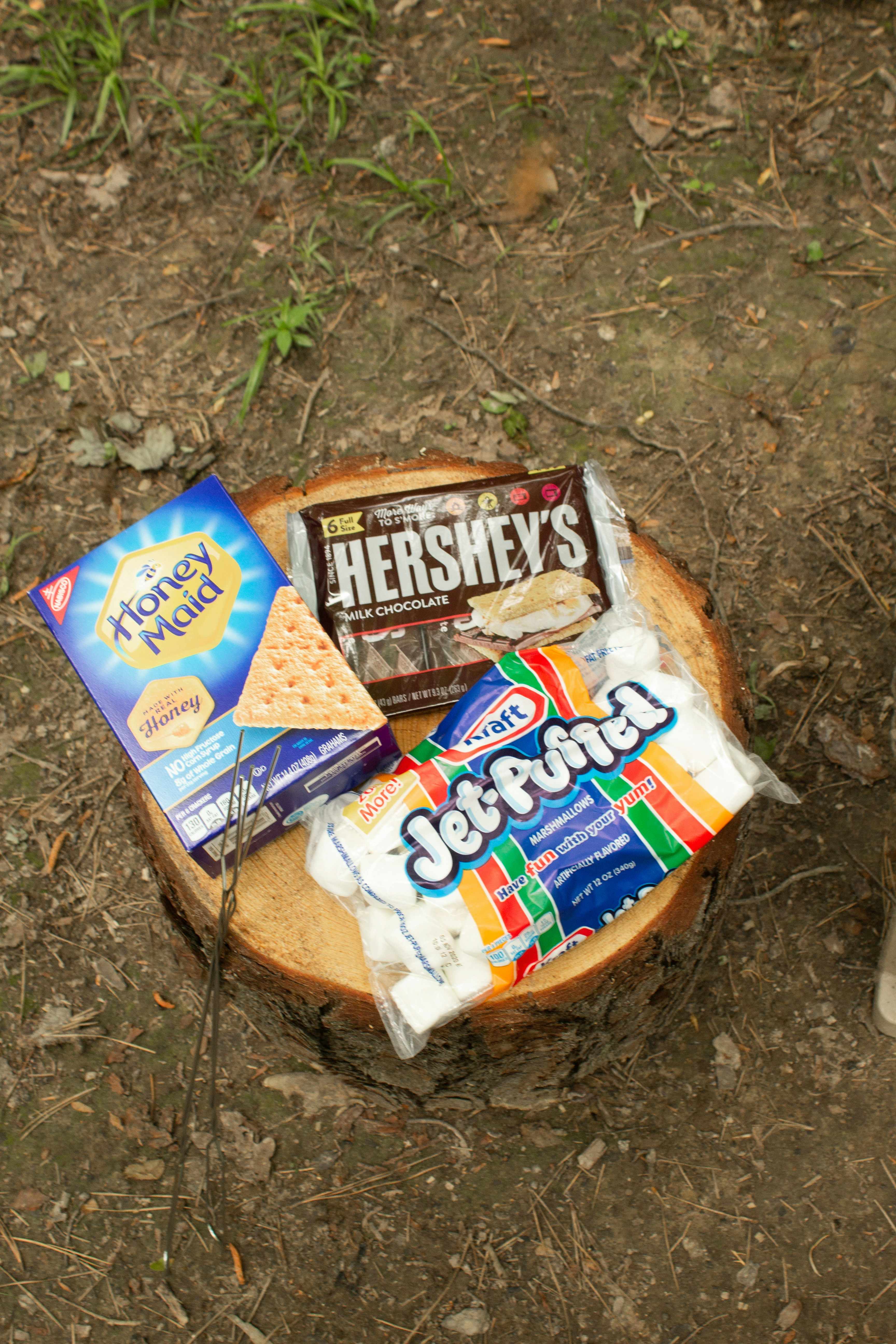 Stump-top S'mores Tray: Chocolate, Marshmallows, and Grahams on Rustic Wood