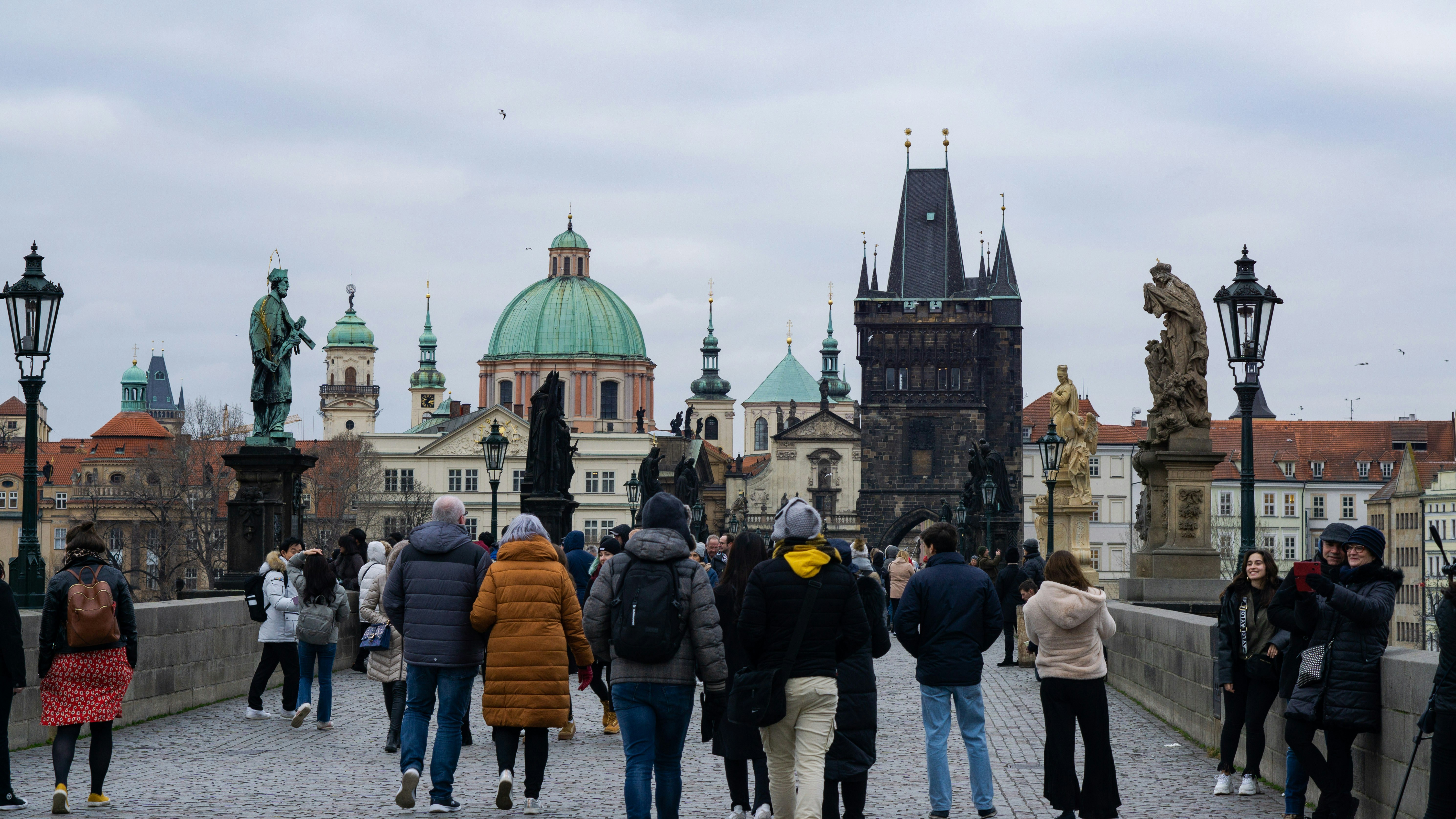 walking the charles bridge in Prague