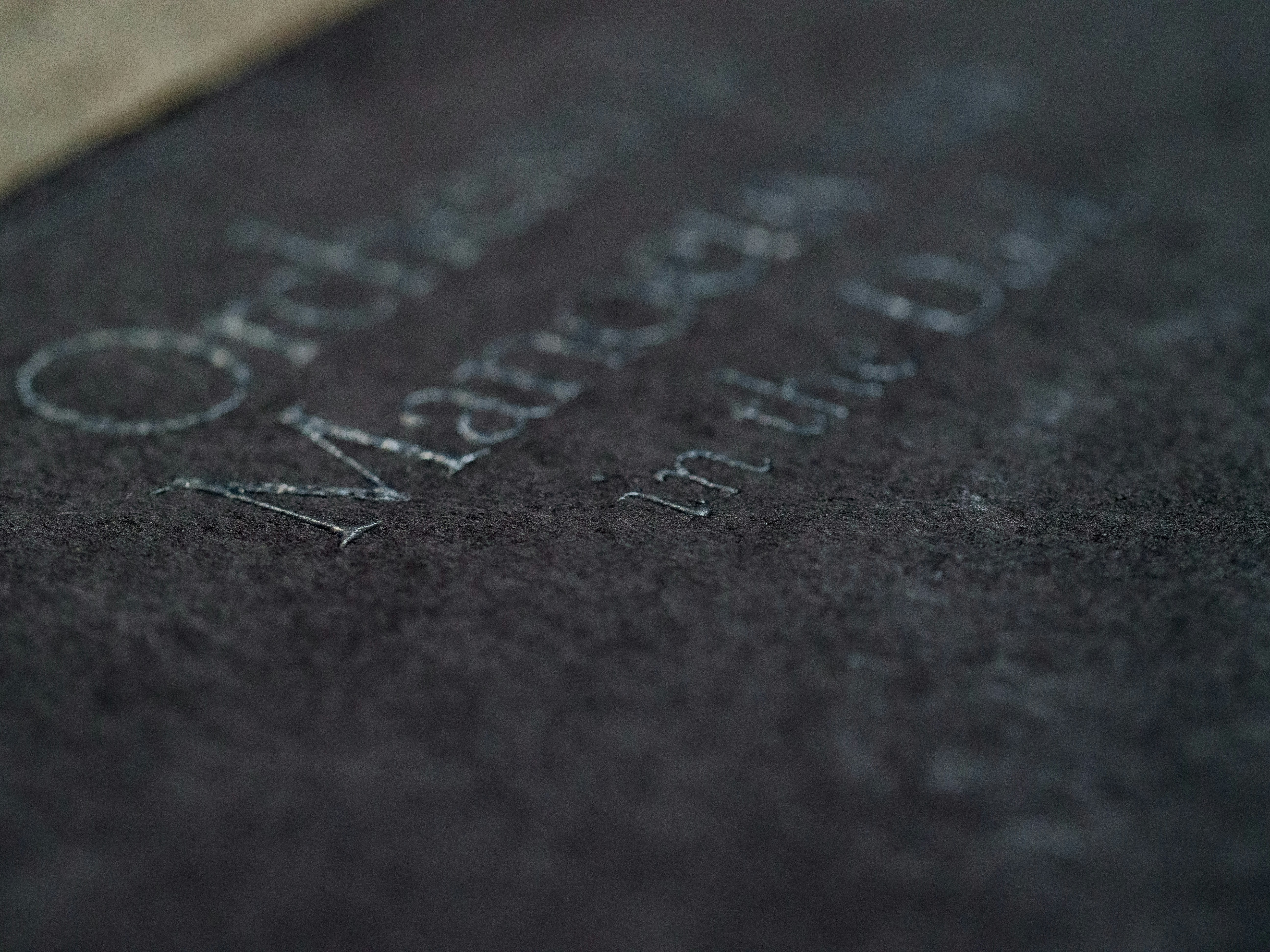 Whispered Script on Dark Slate