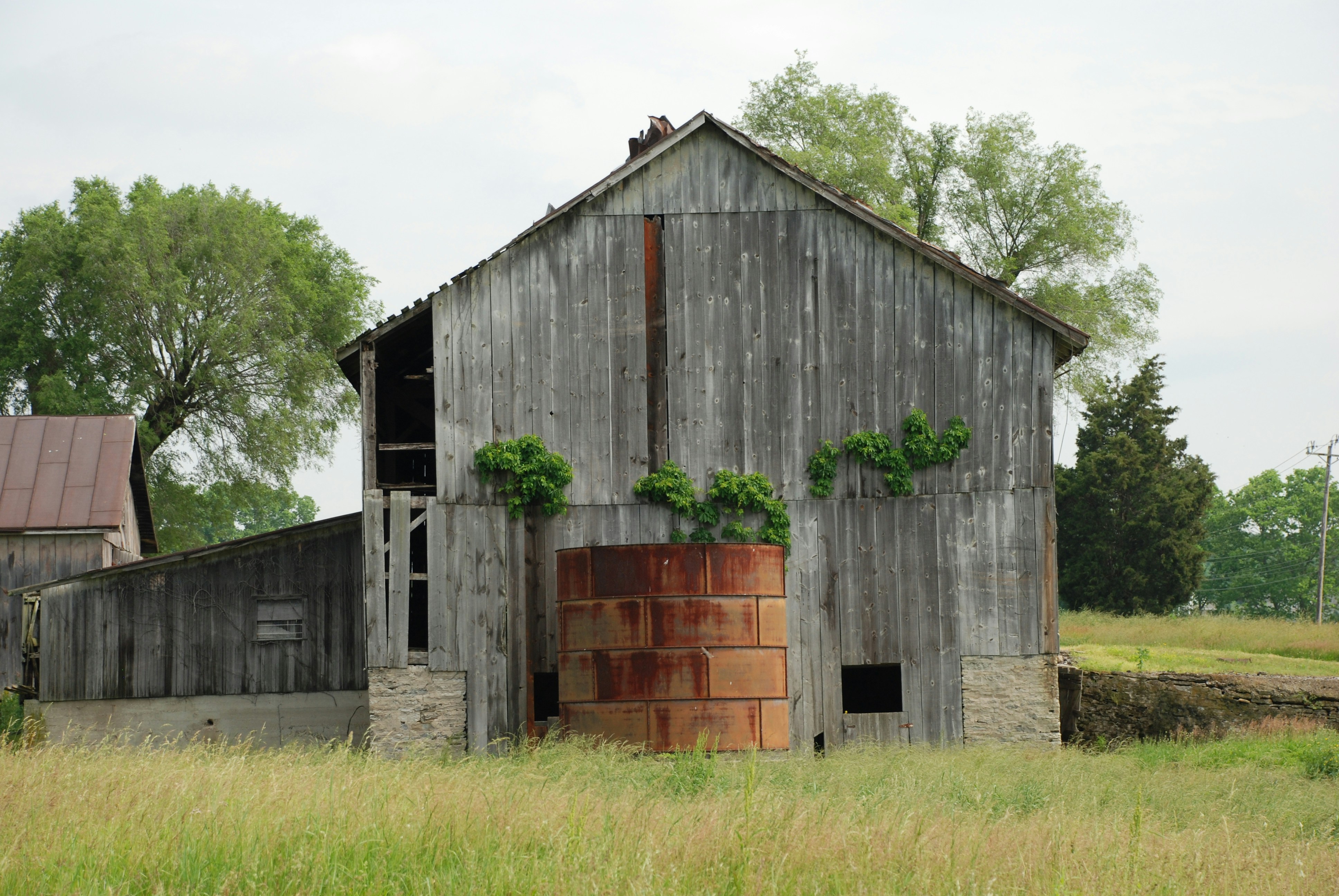 Brown wooden barn on green grass field during daytime photo – Free ...