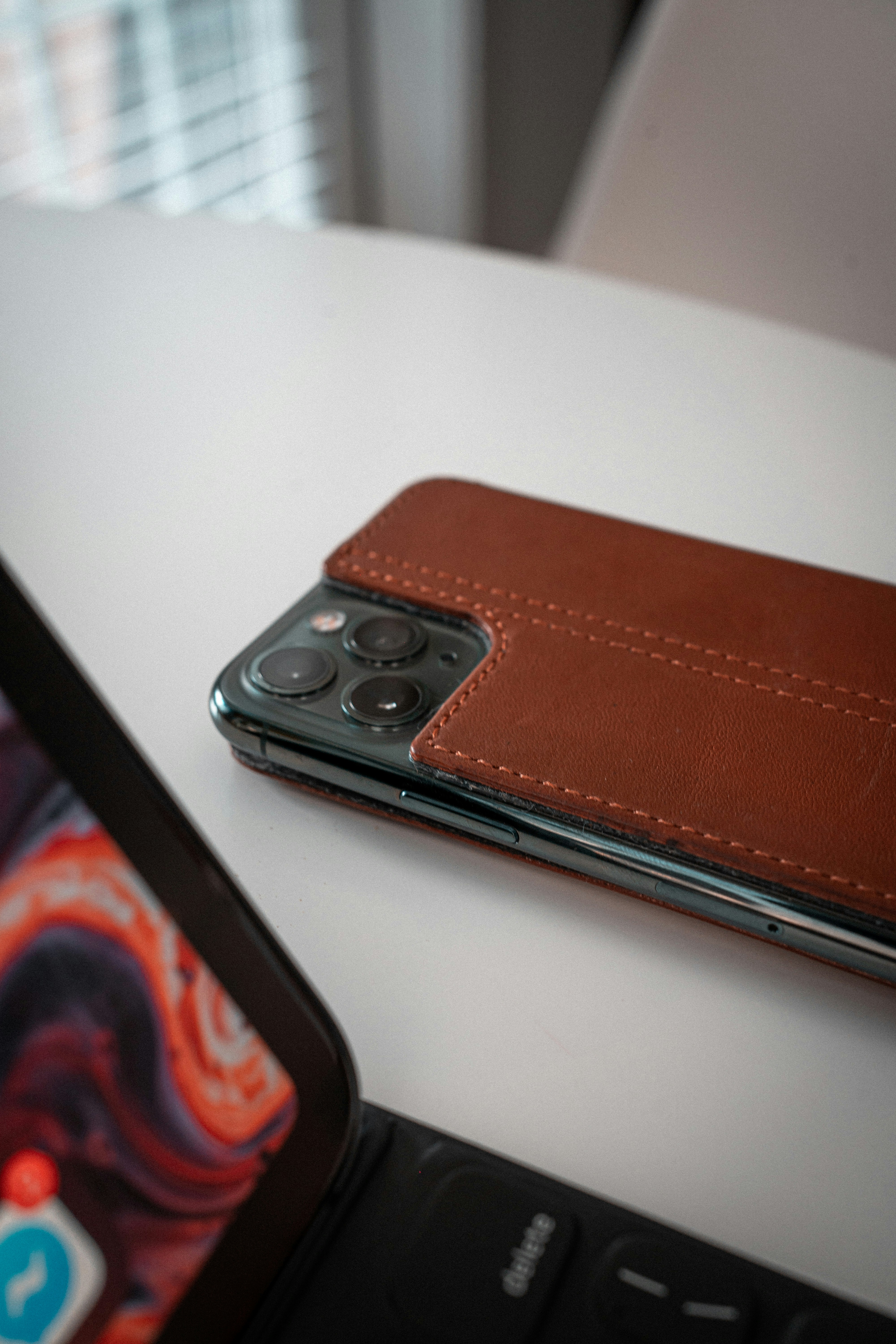Leather-Wrapped iPhone Quietly Anchors a Minimal Desk Scene