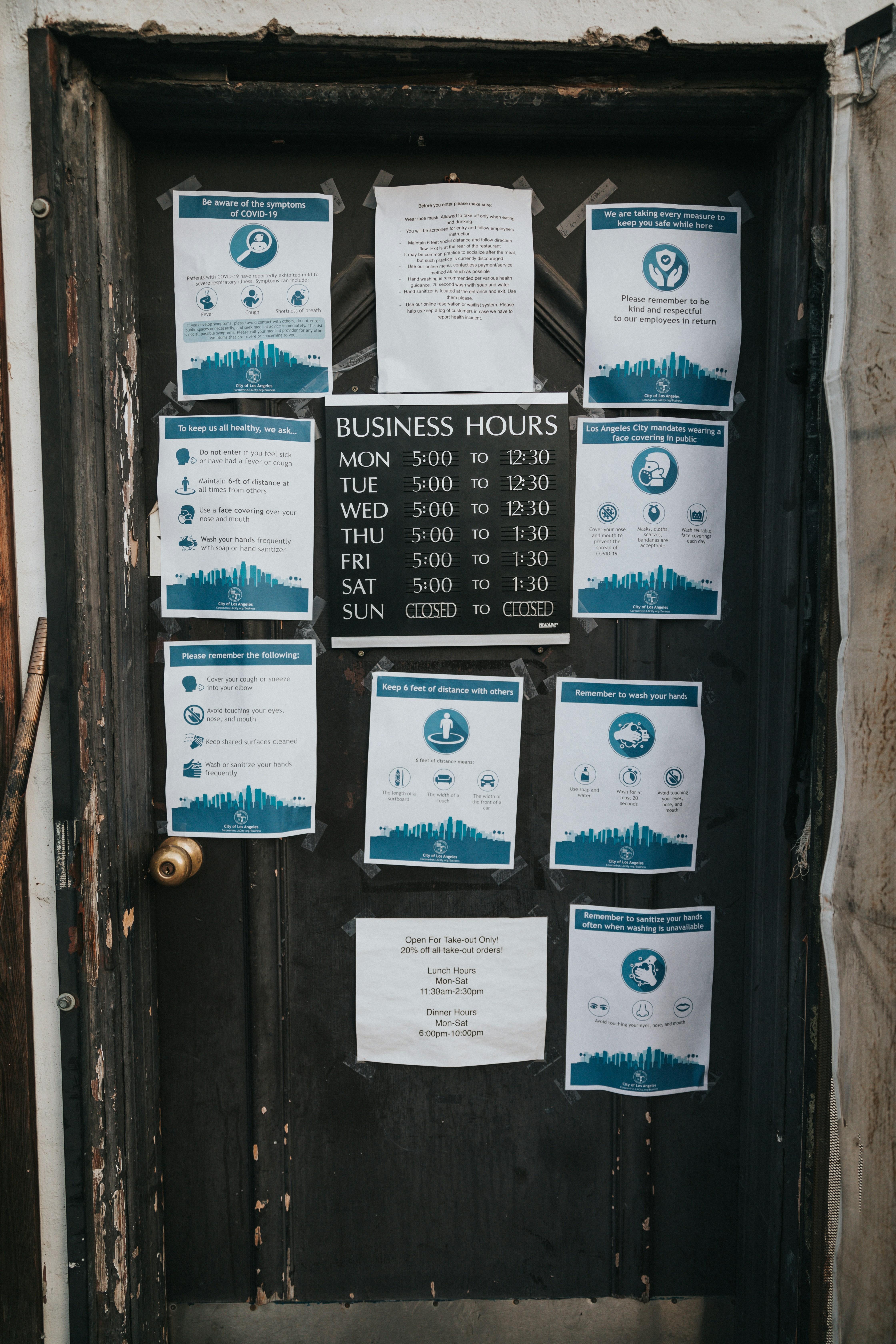 white printer paper on brown wooden door