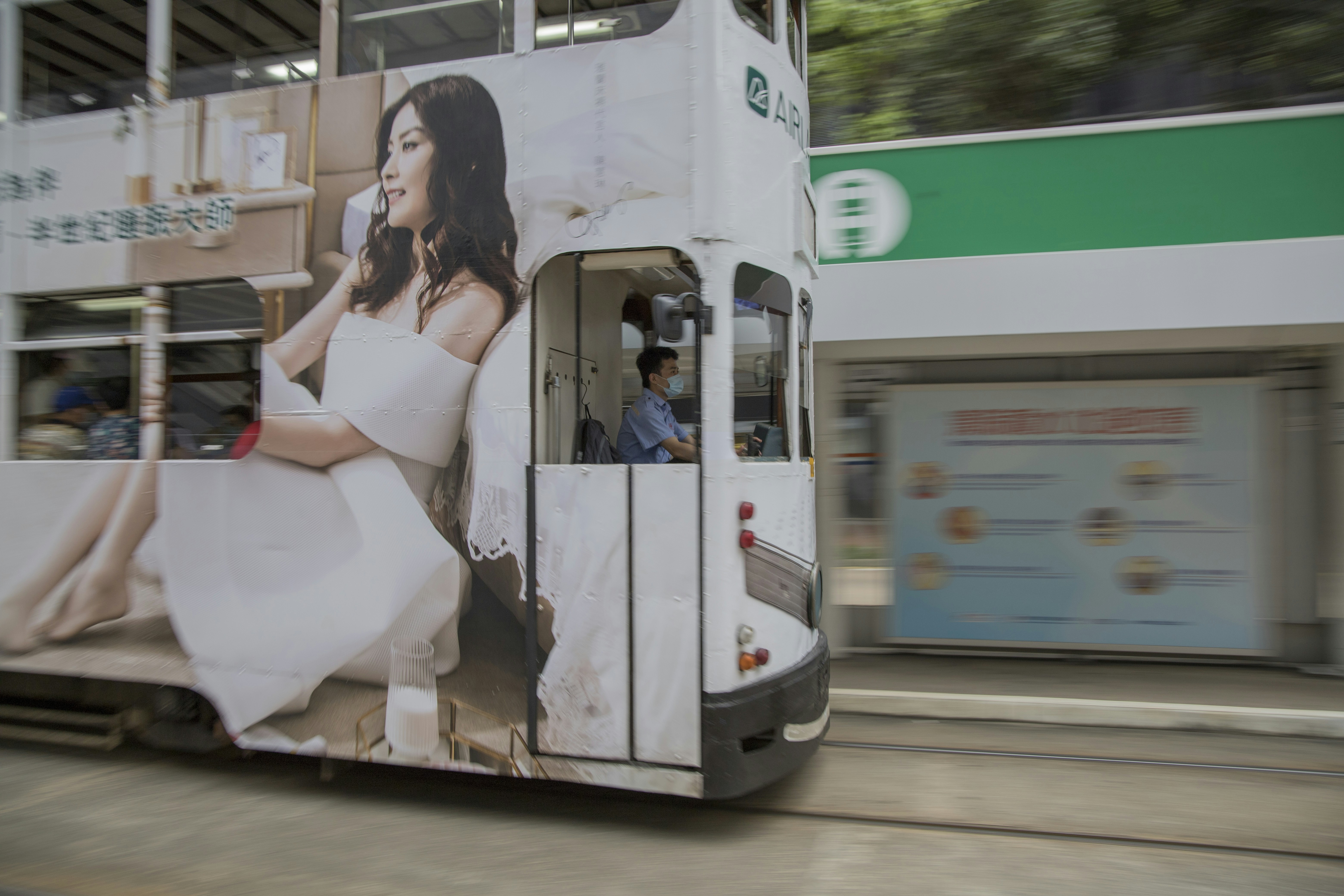 Fashion on Rails: A Blurred Tram Ad in Transit