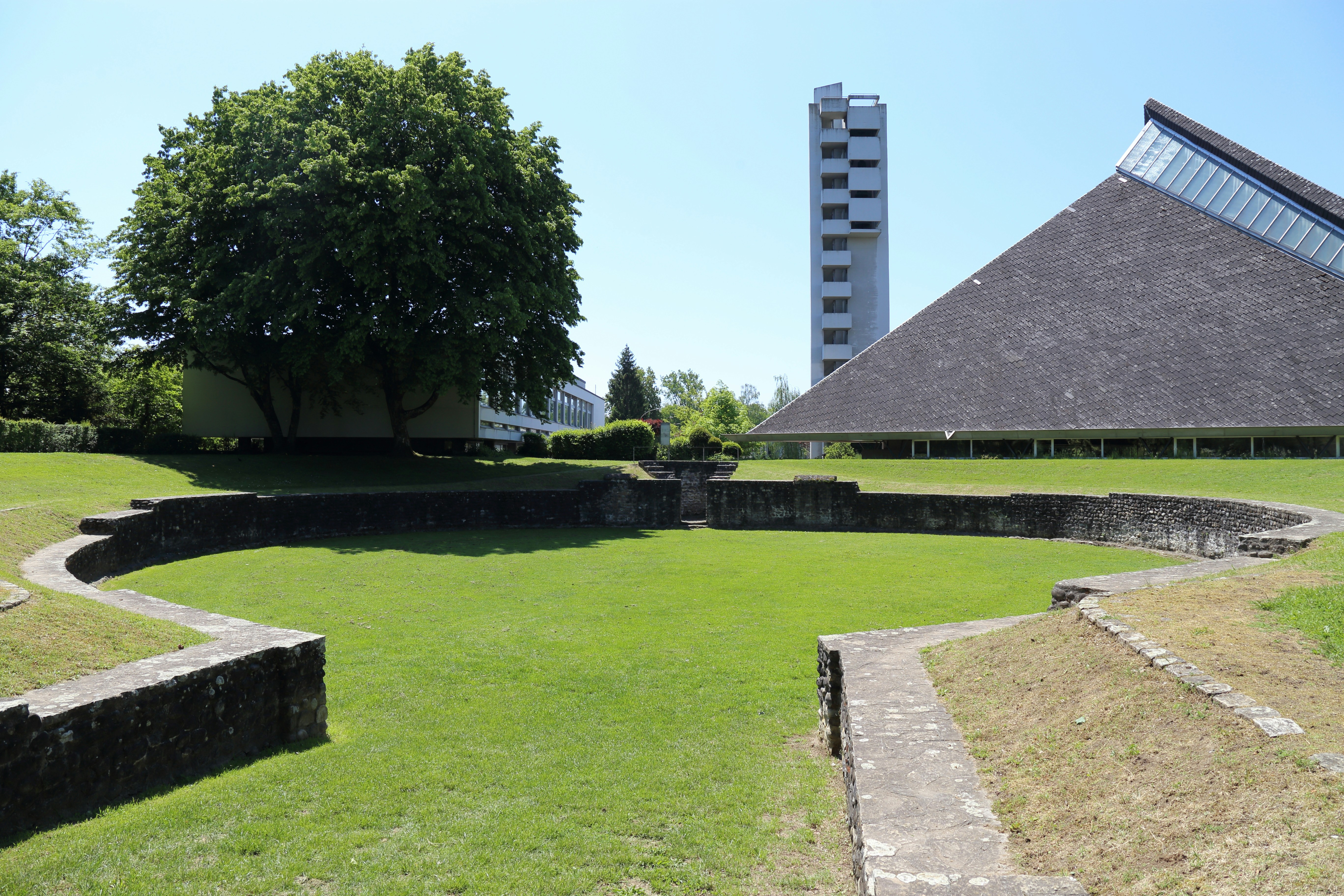 Concentric Stone Terraces Framing a Modern Campus Skyline