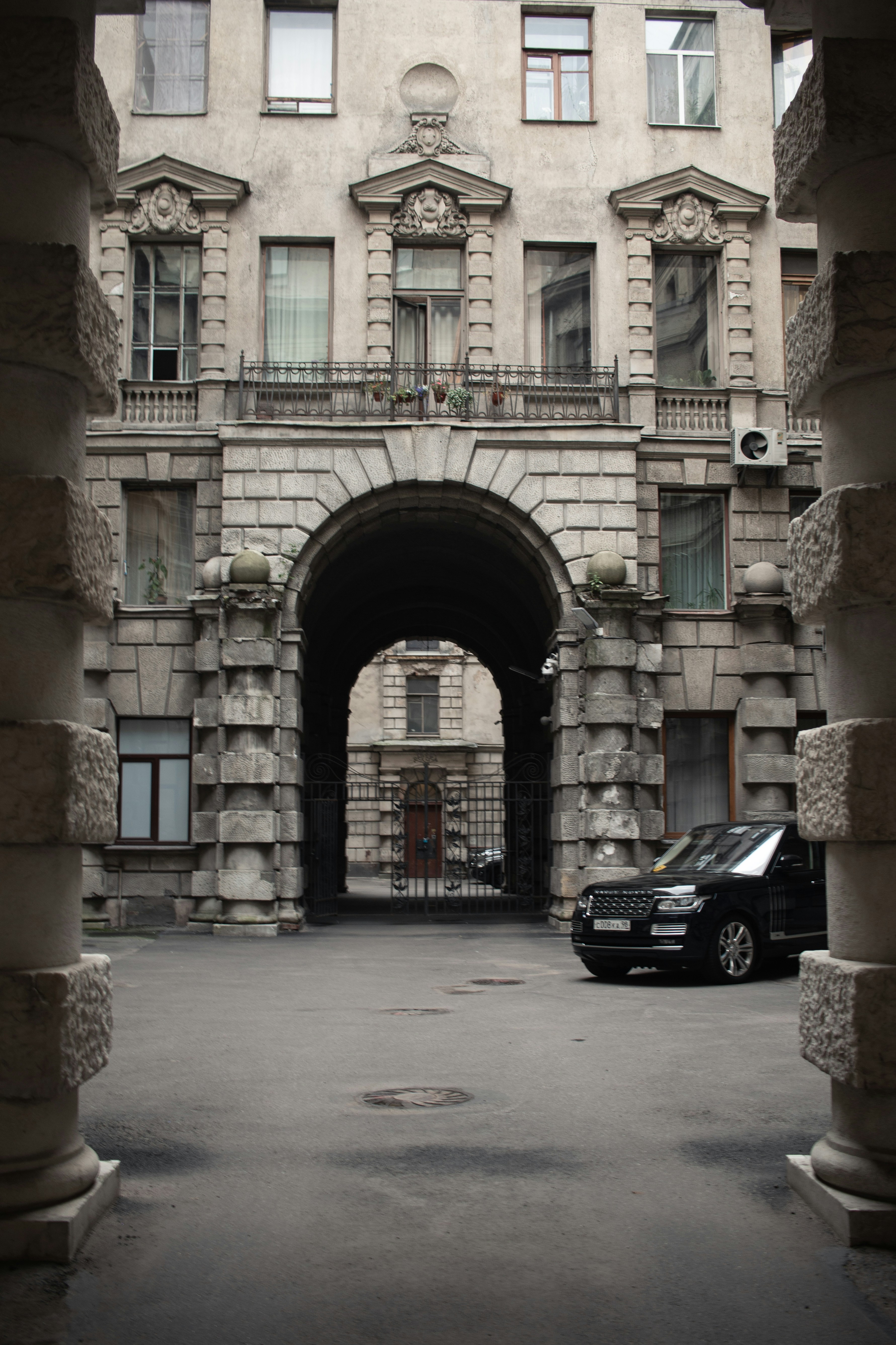 Stone Archway Through a Historic Courtyard