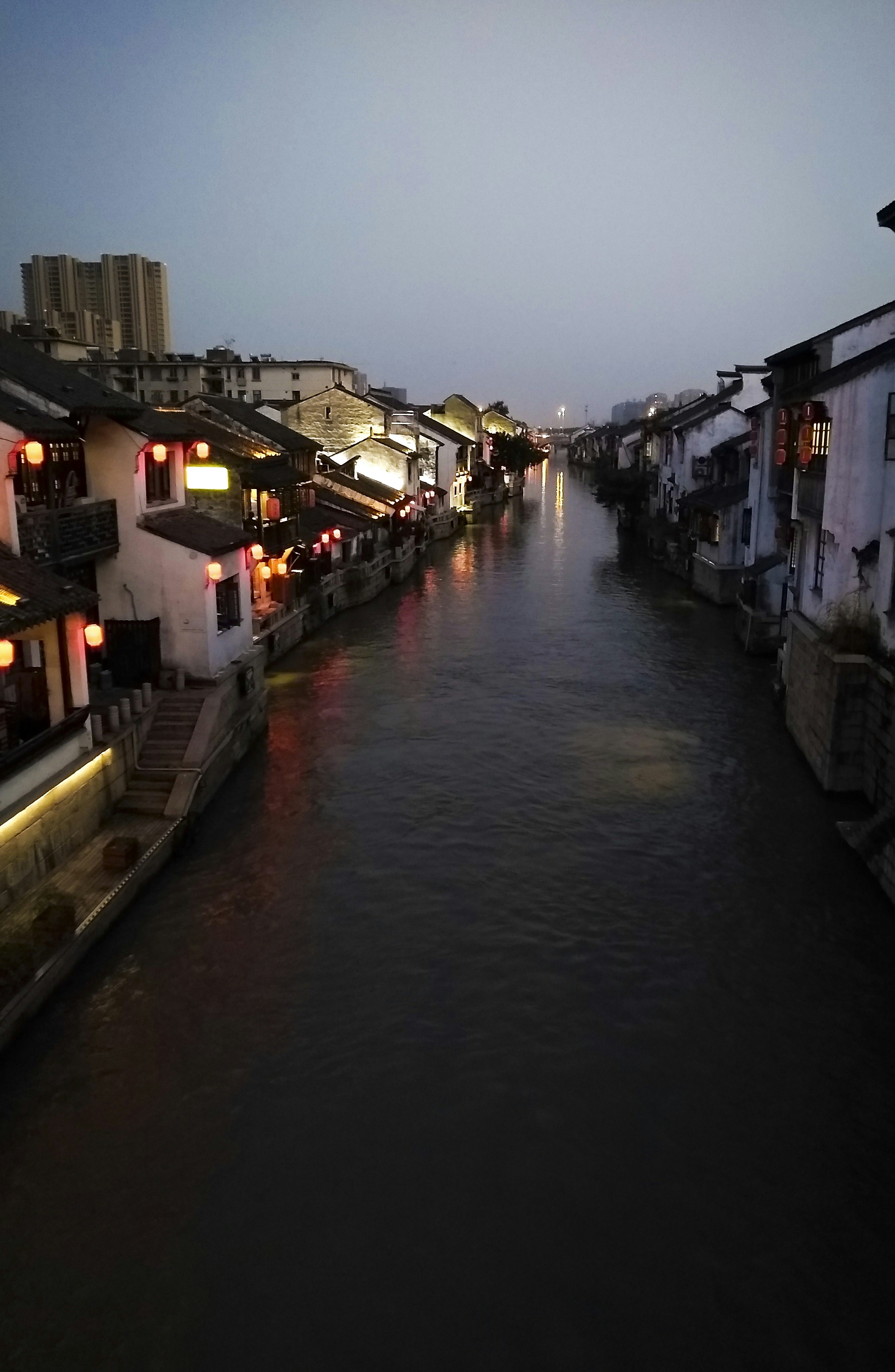 River between houses during night time photo – Free China Image on Unsplash