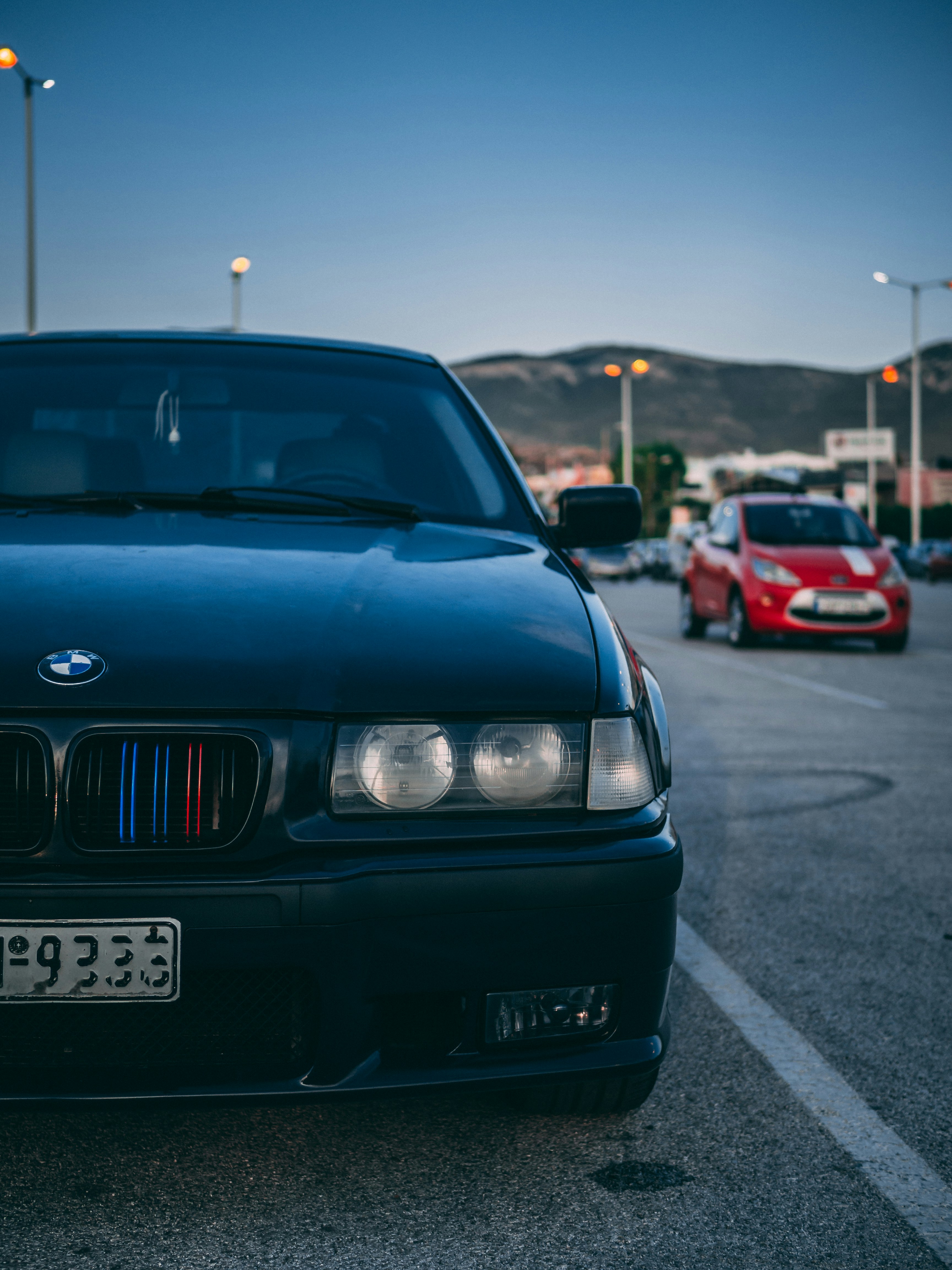 blue bmw m 3 on road during daytime