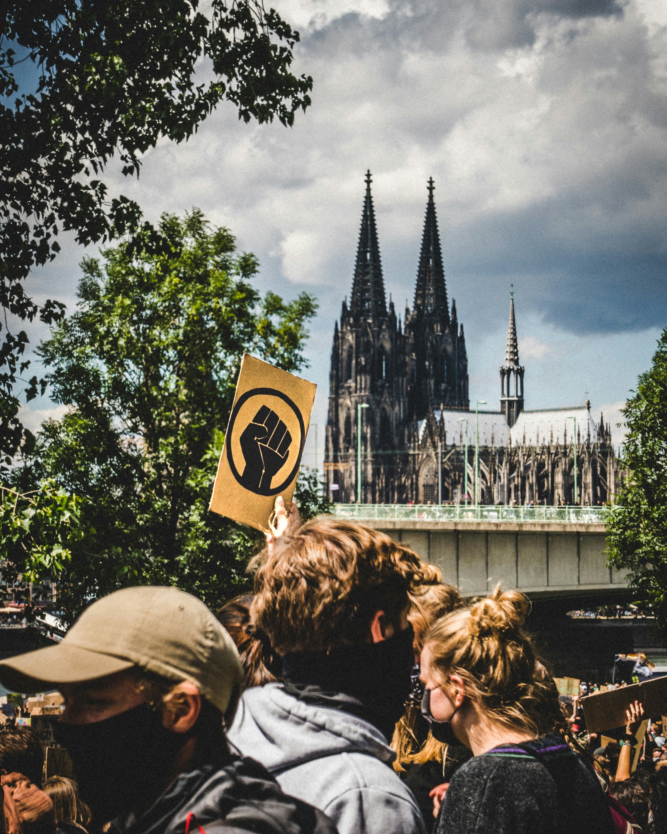Solidarity in Stone: A Fist Sign Framed by Twin Spires