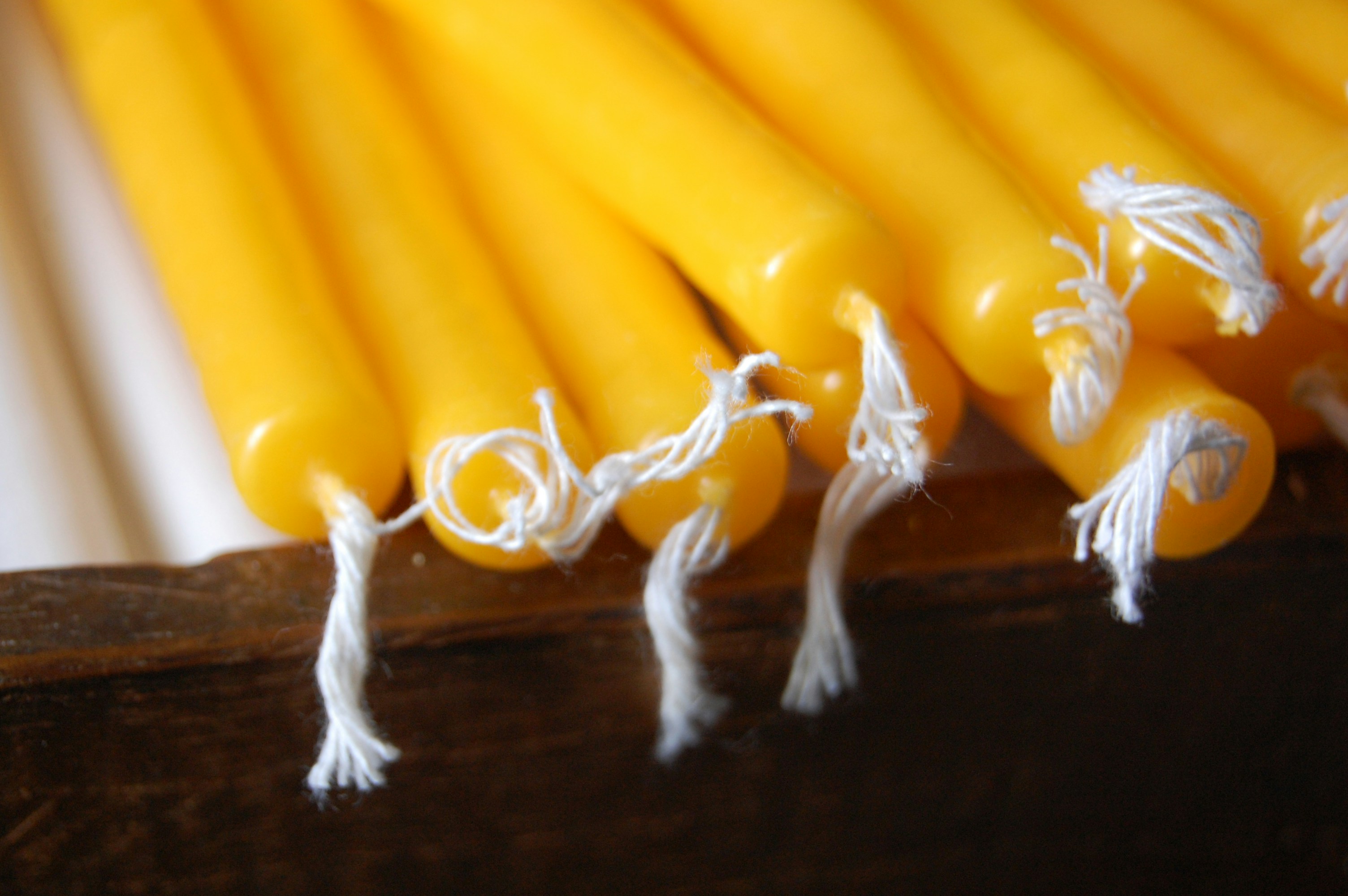 yellow and white rope on brown wooden table