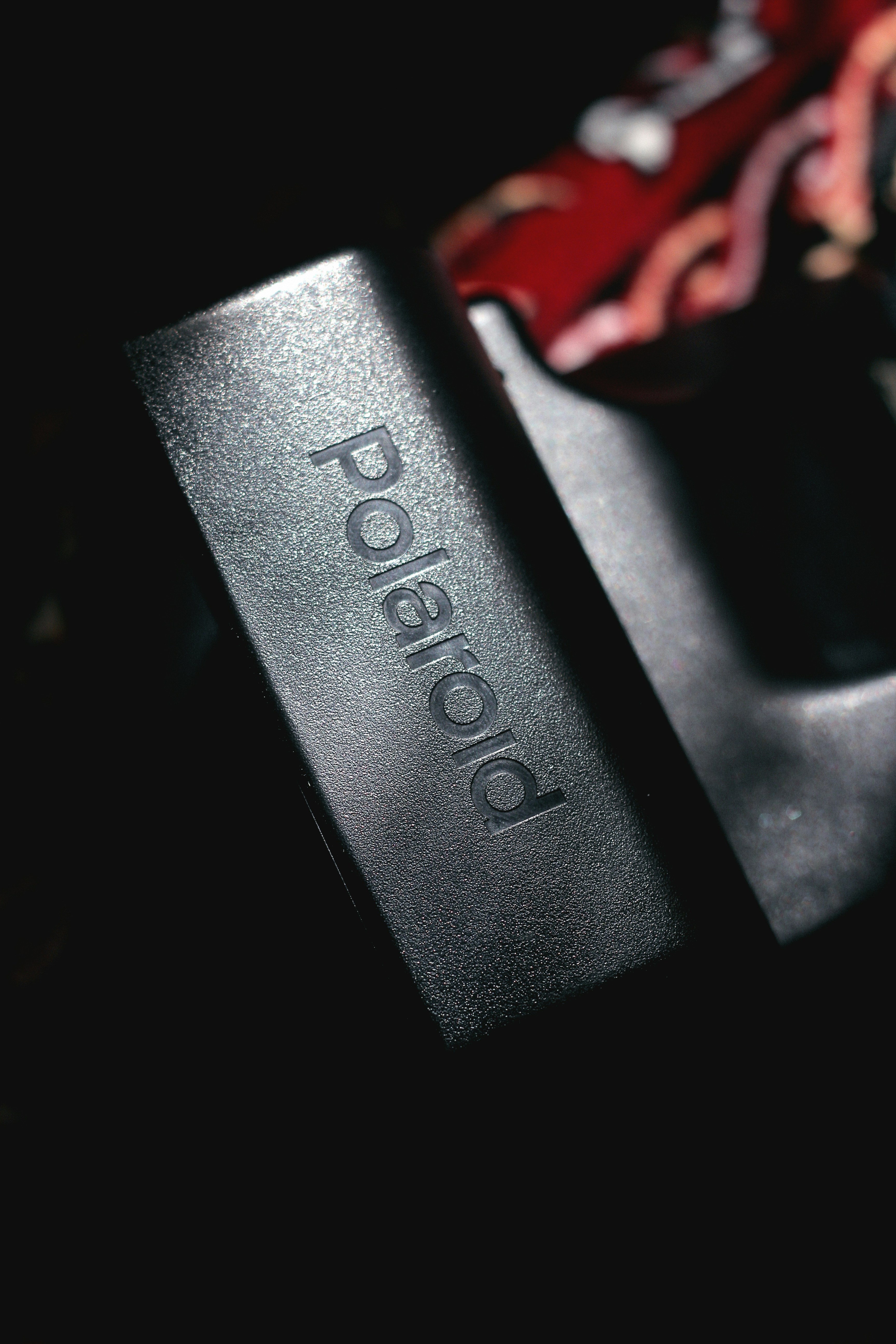Polaroid of a brand mark: close-up of a textured Polarod switch