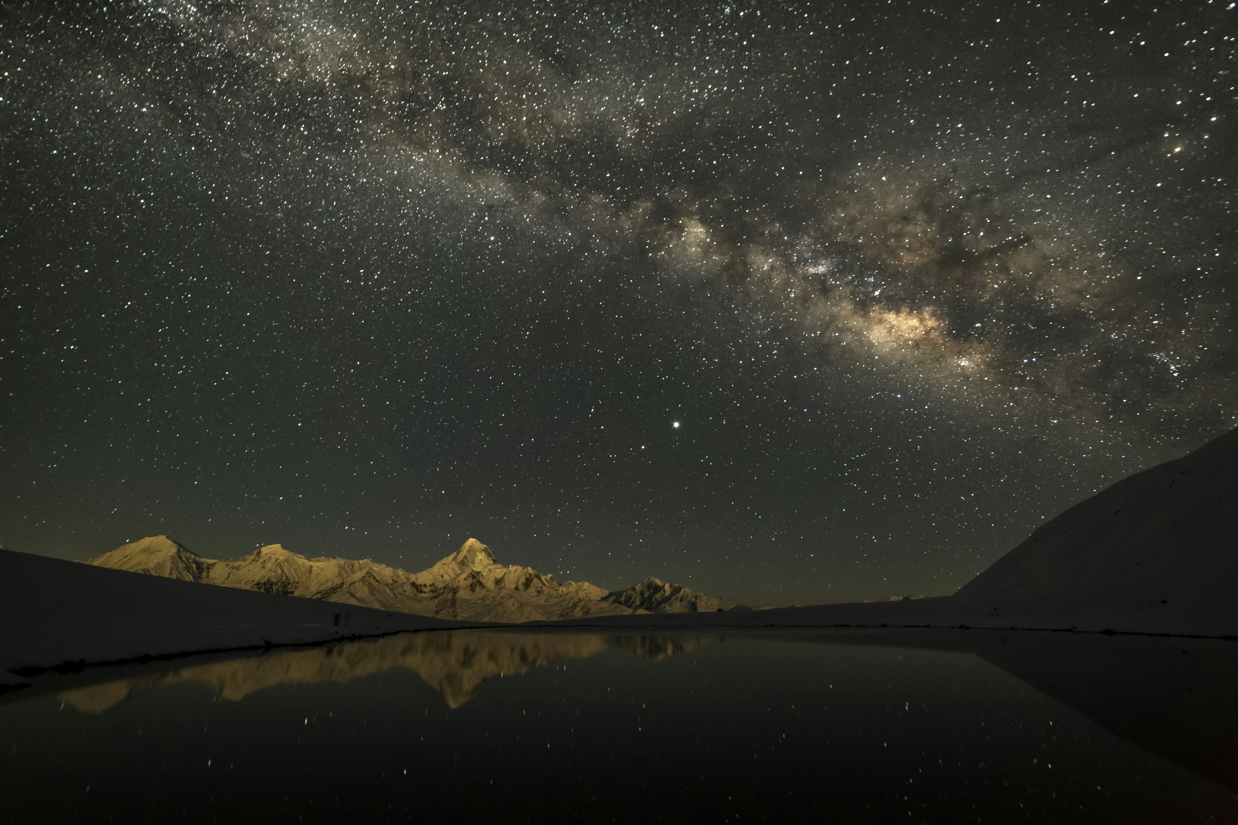 Body of water near mountain under starry night photo – Free Grey Image ...