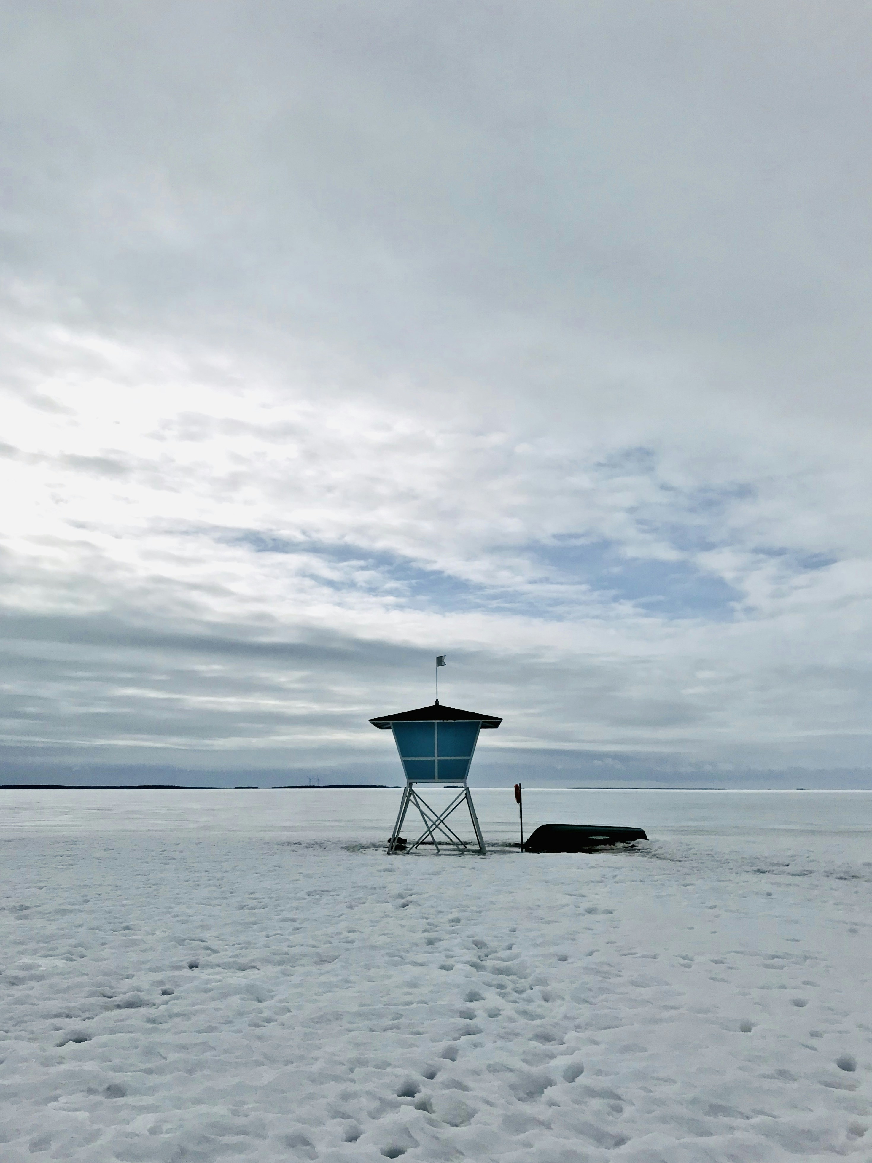 Lifeguard Tower Against a Vast Snow-Plain Sky