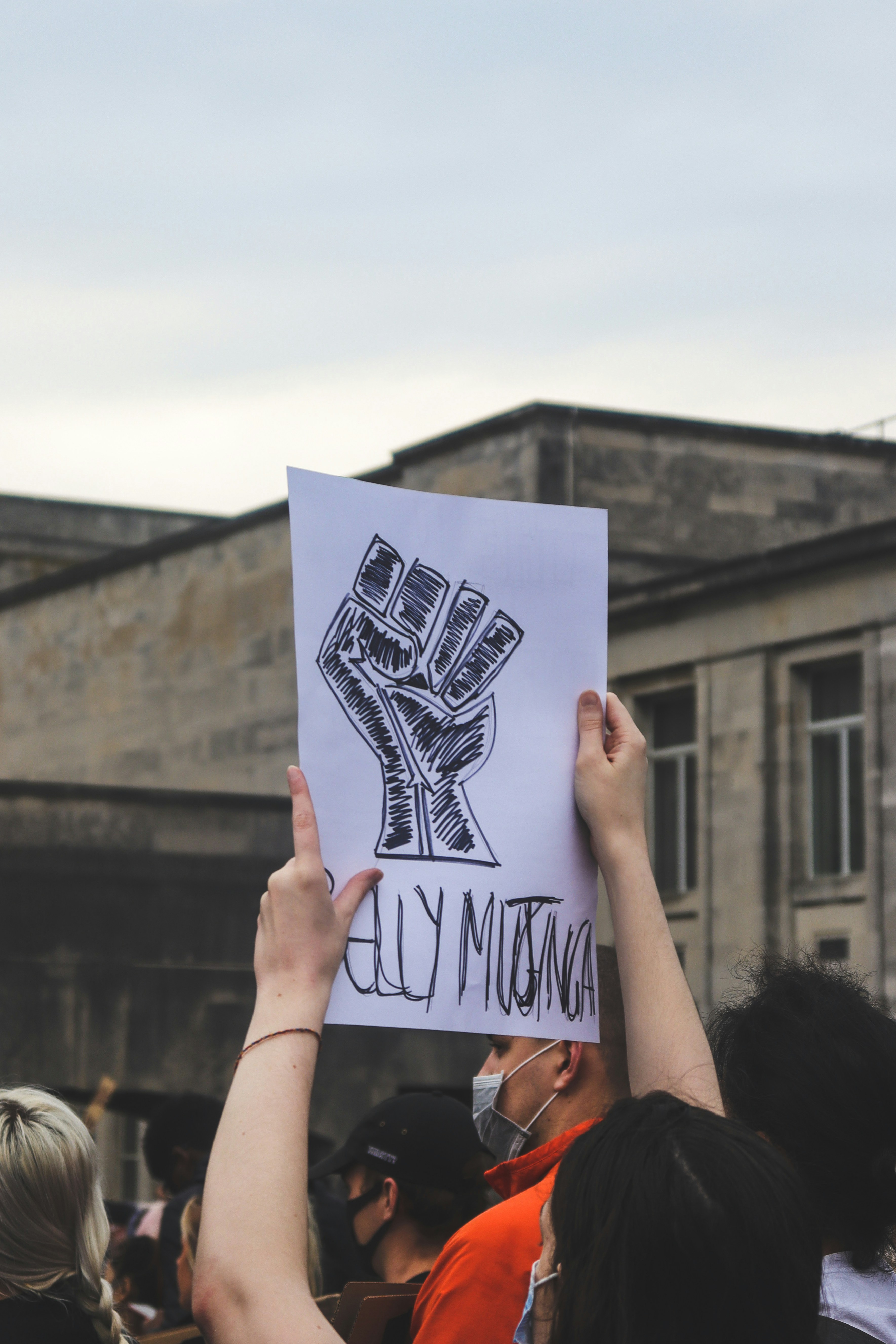 Raised Fist Banner Over a City Protest