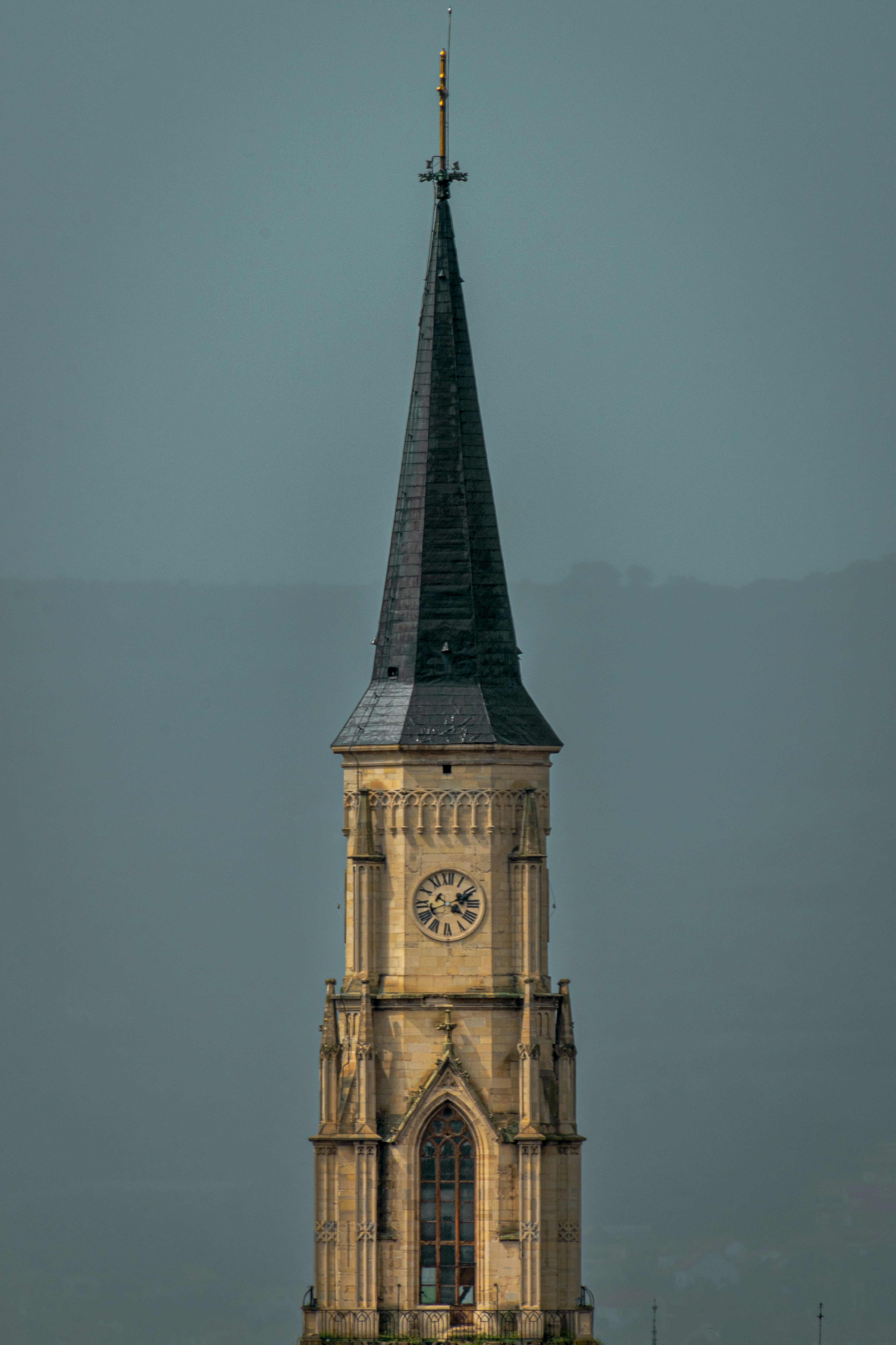 a tall tower with a clock on the top of it