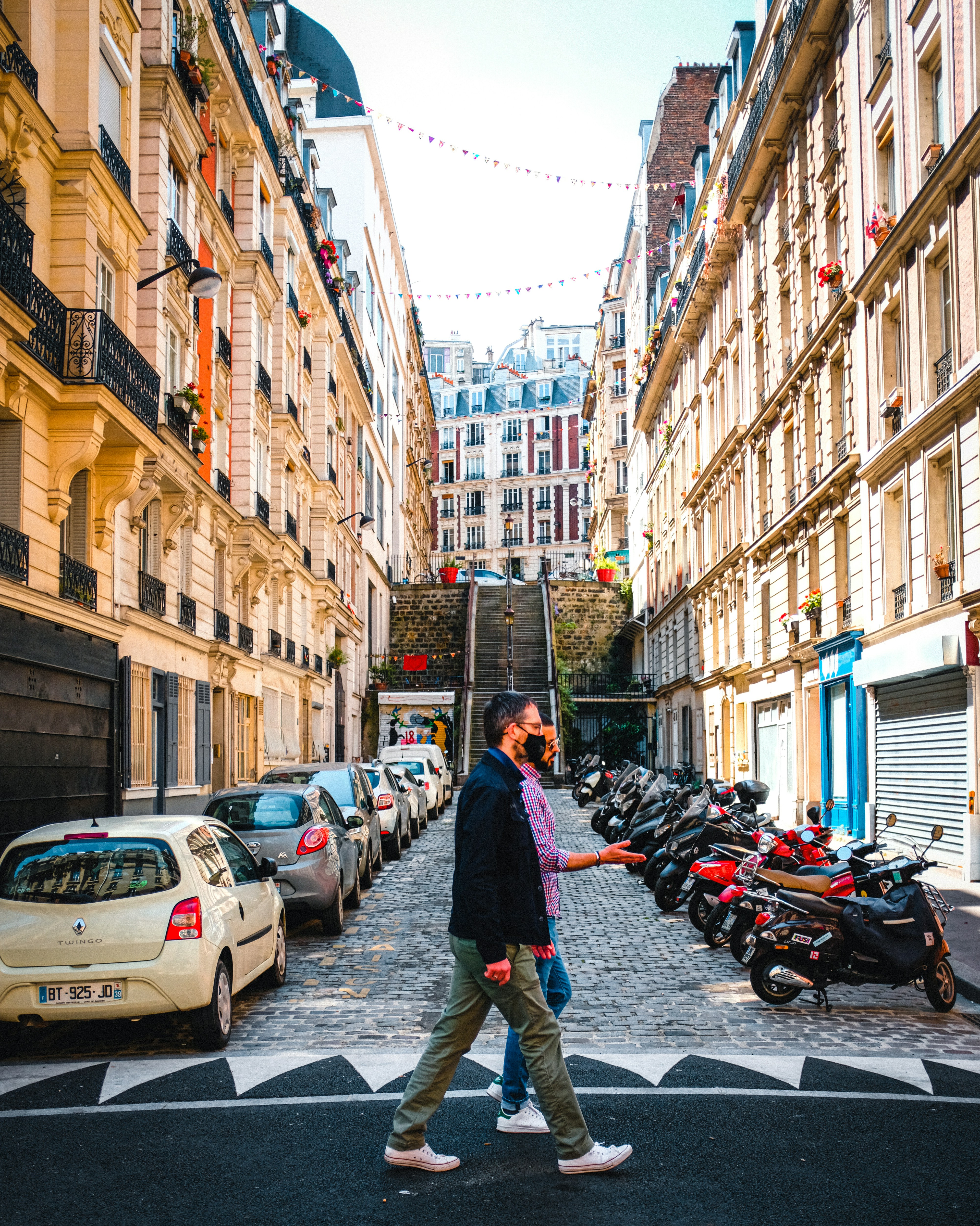 Passing Through a Parisian Alley: Pedestrians among Historic Facades