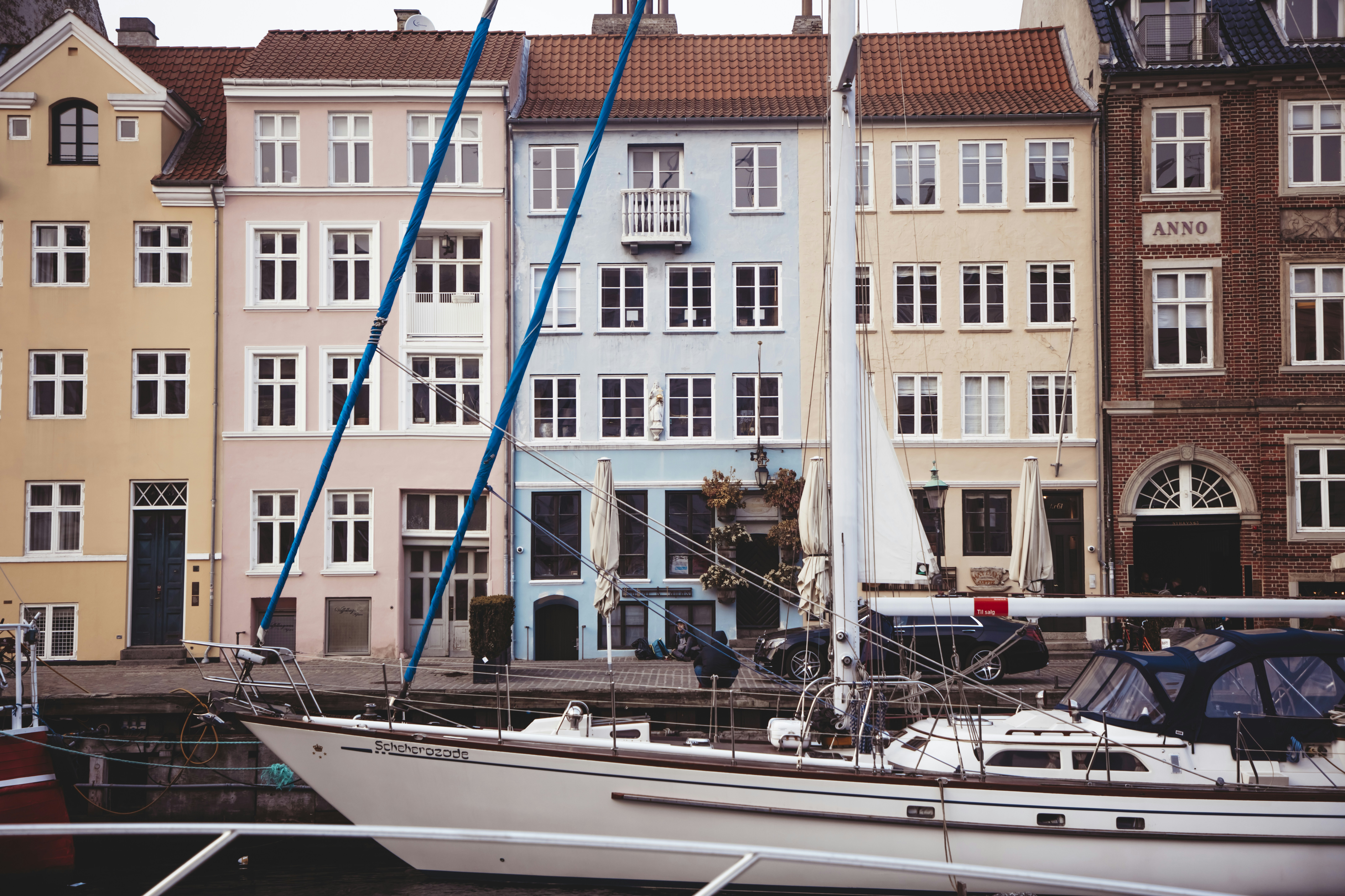 Pastel Row by the Marina: Boats and Townhouses in Quiet Reflections
