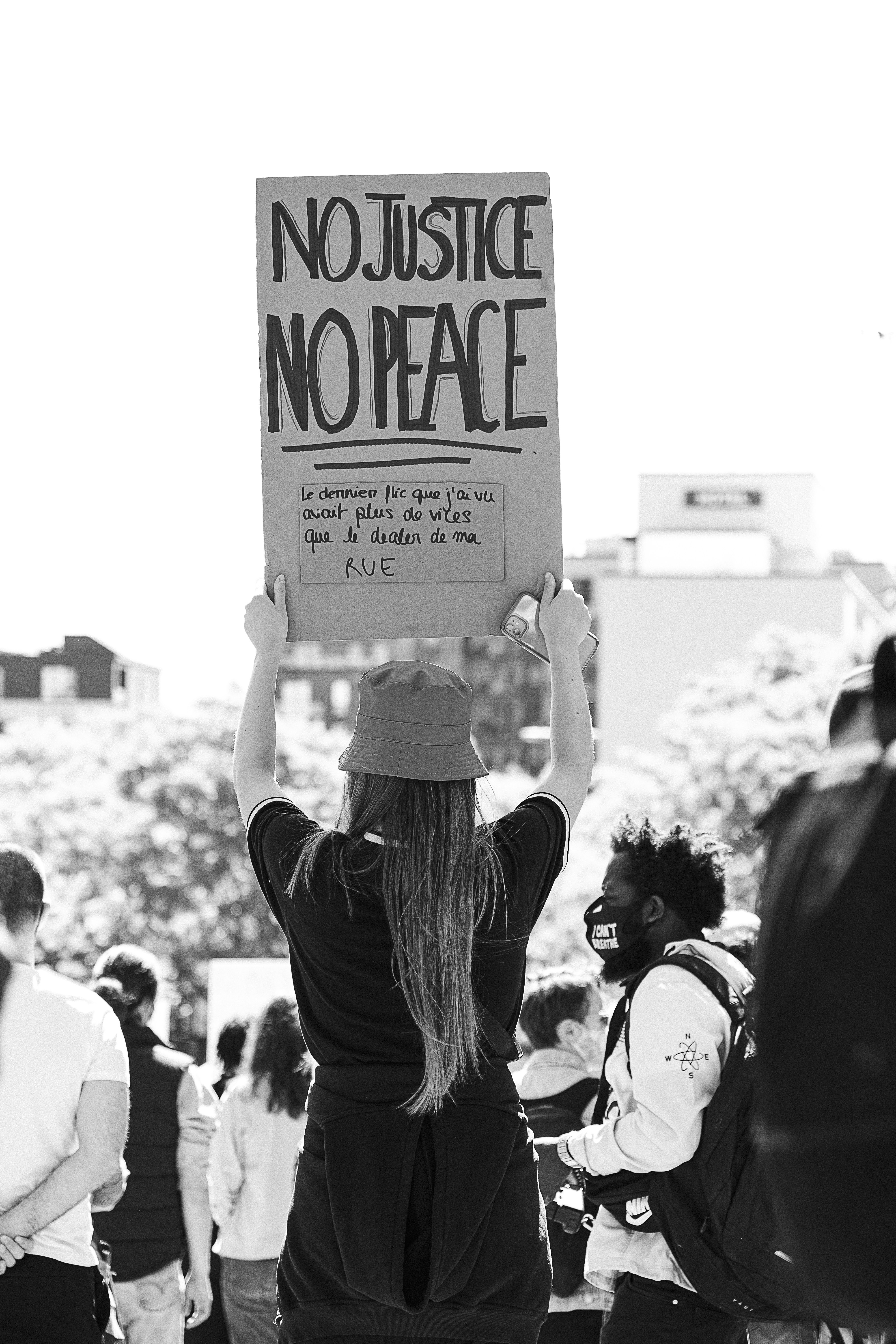 Banner of Resolve: No Justice No Peace in Monochrome Protest