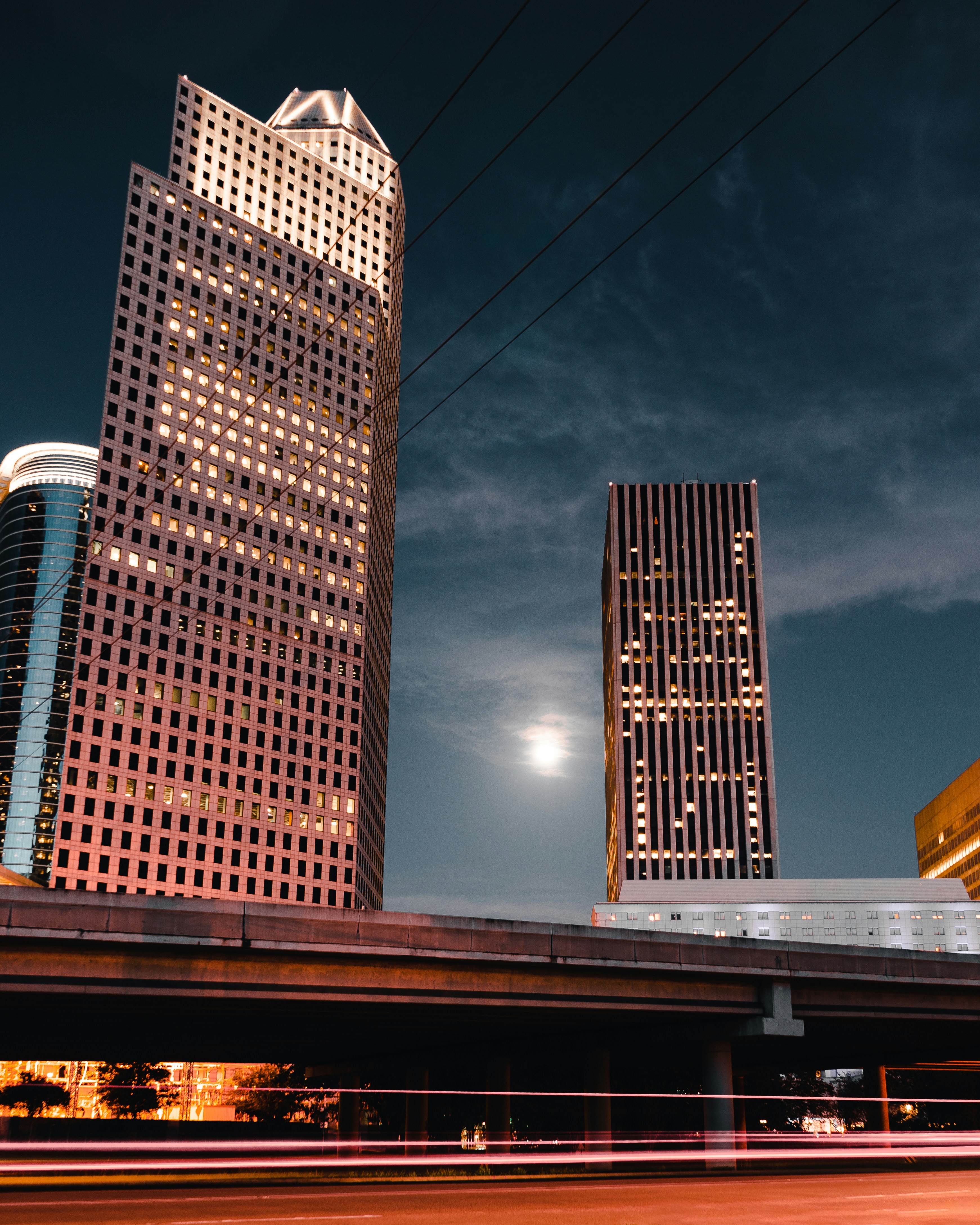 Moonlit Monoliths Framing a Neon Highway