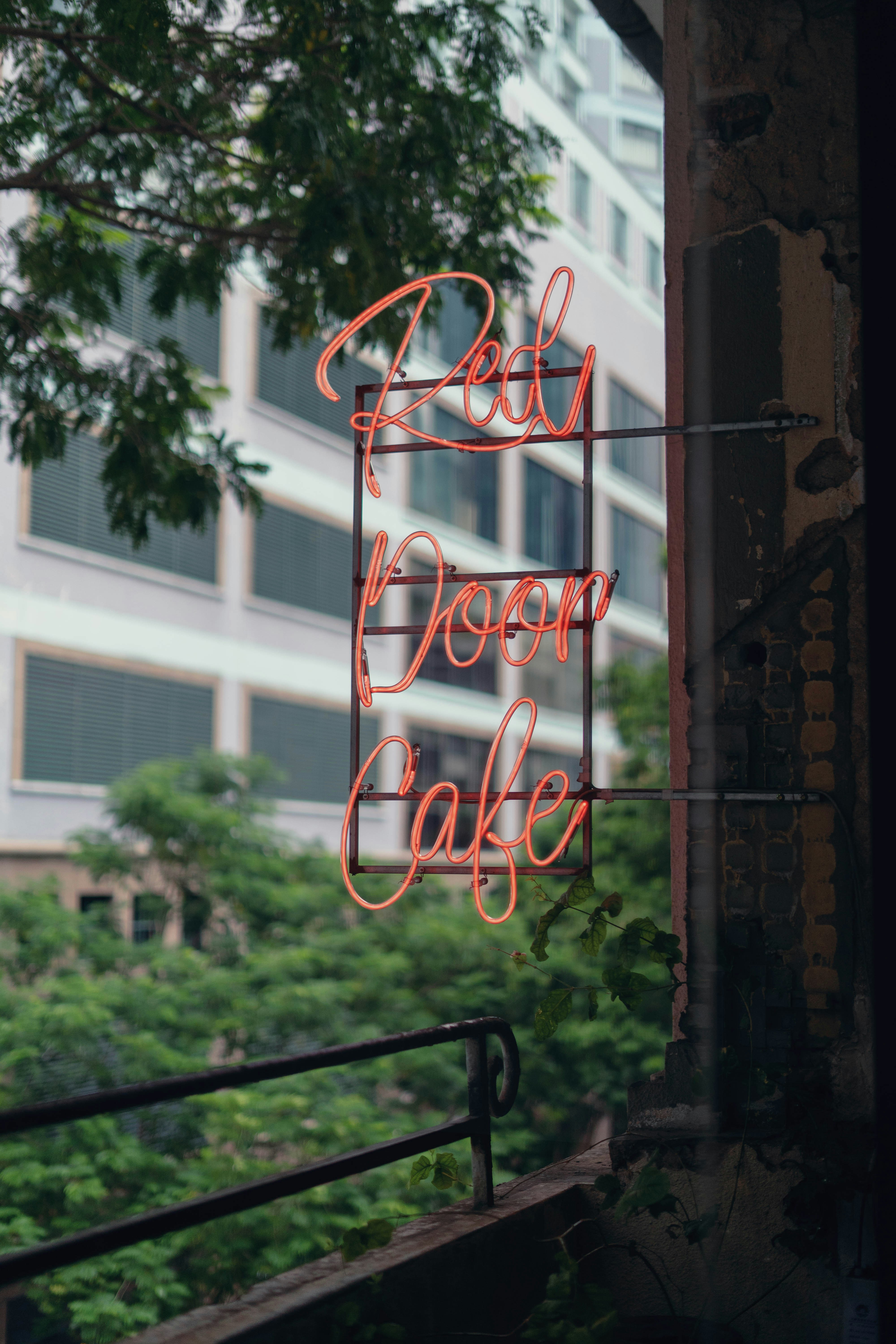 Neon Script over Weathered Brick: Red Door Café