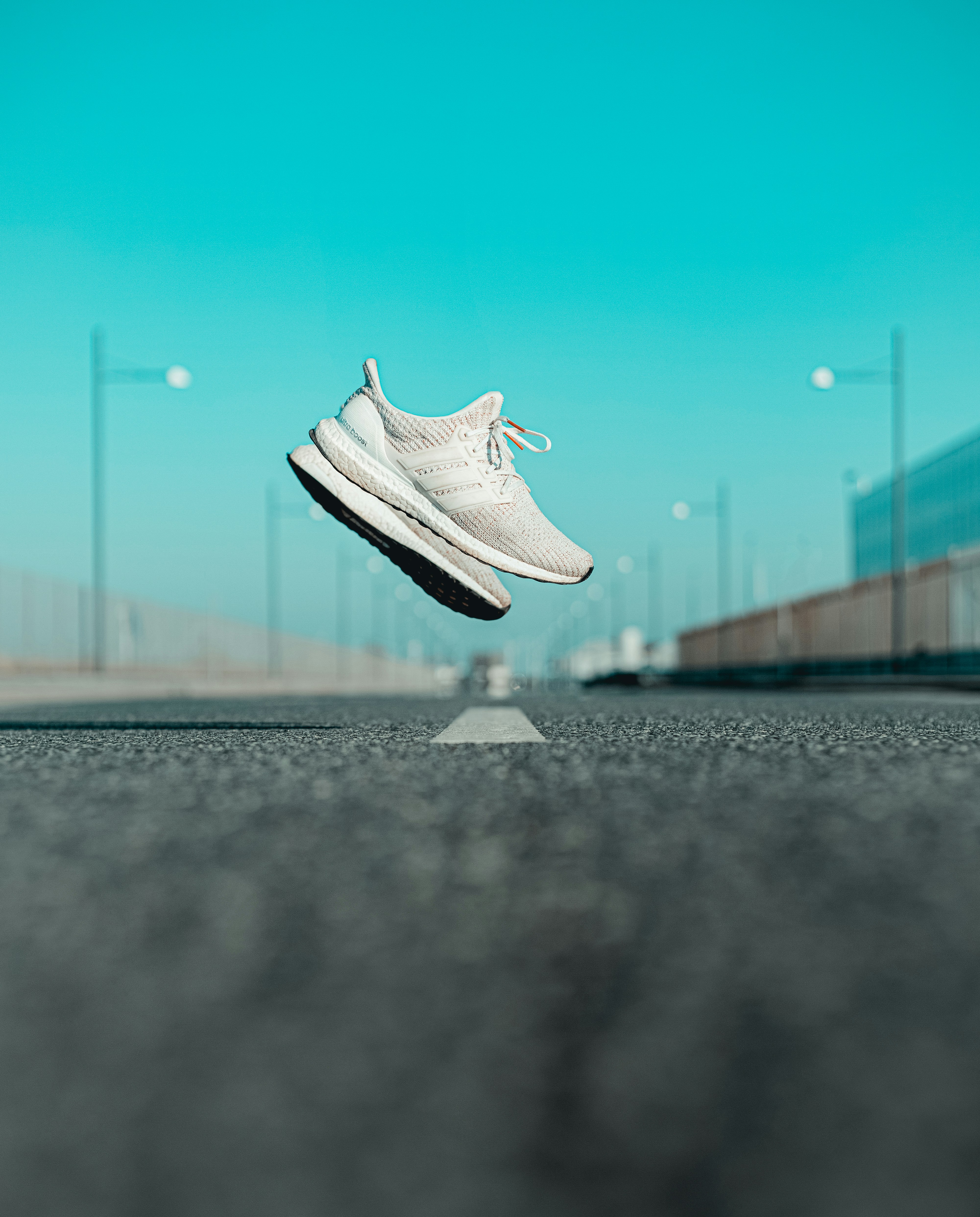 White nike athletic shoe on road during daytime photo – Free Blue Image ...