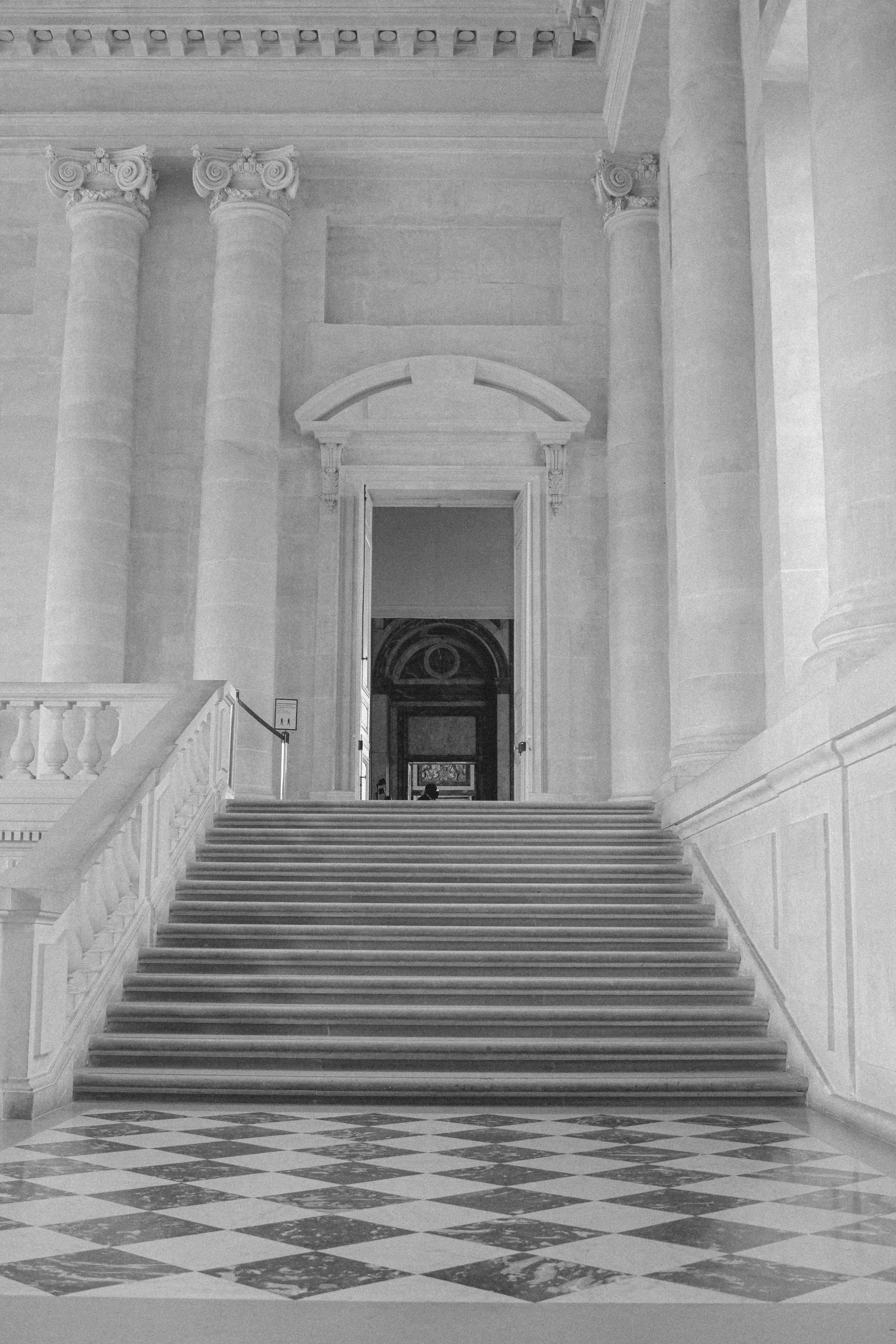 Gray concrete staircase in front of white concrete building photo ...