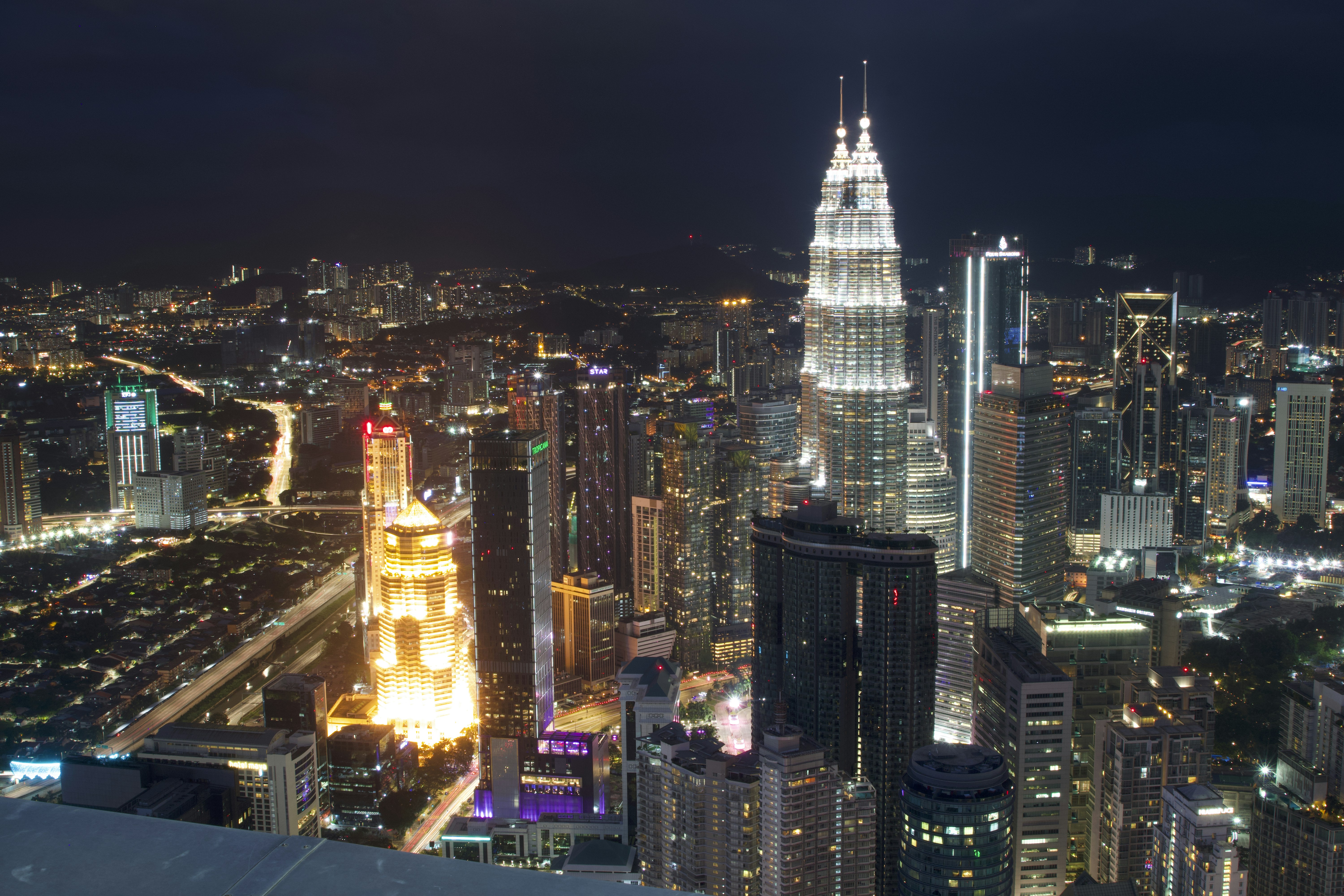 High rise buildings during night time photo – Free Building Image on ...