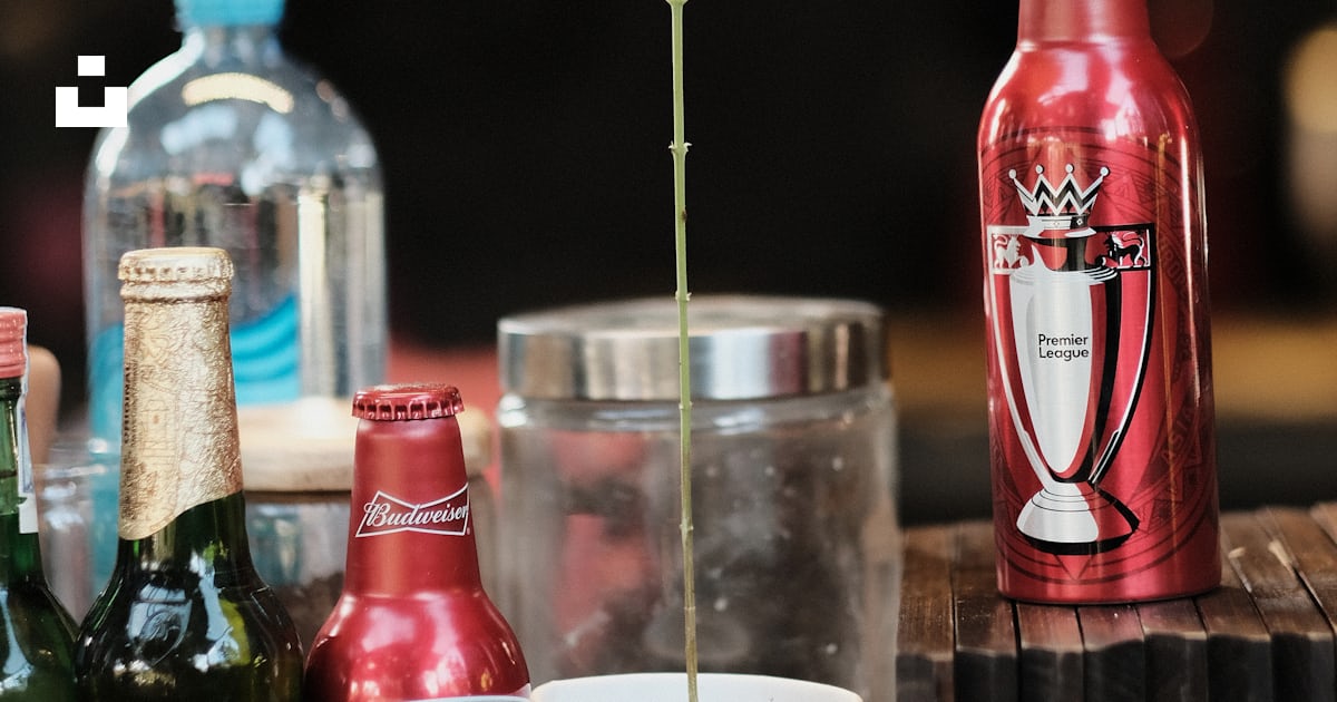 Red Glass Bottle Beside Clear Glass Bottle Photo Free Lâm đồng Image