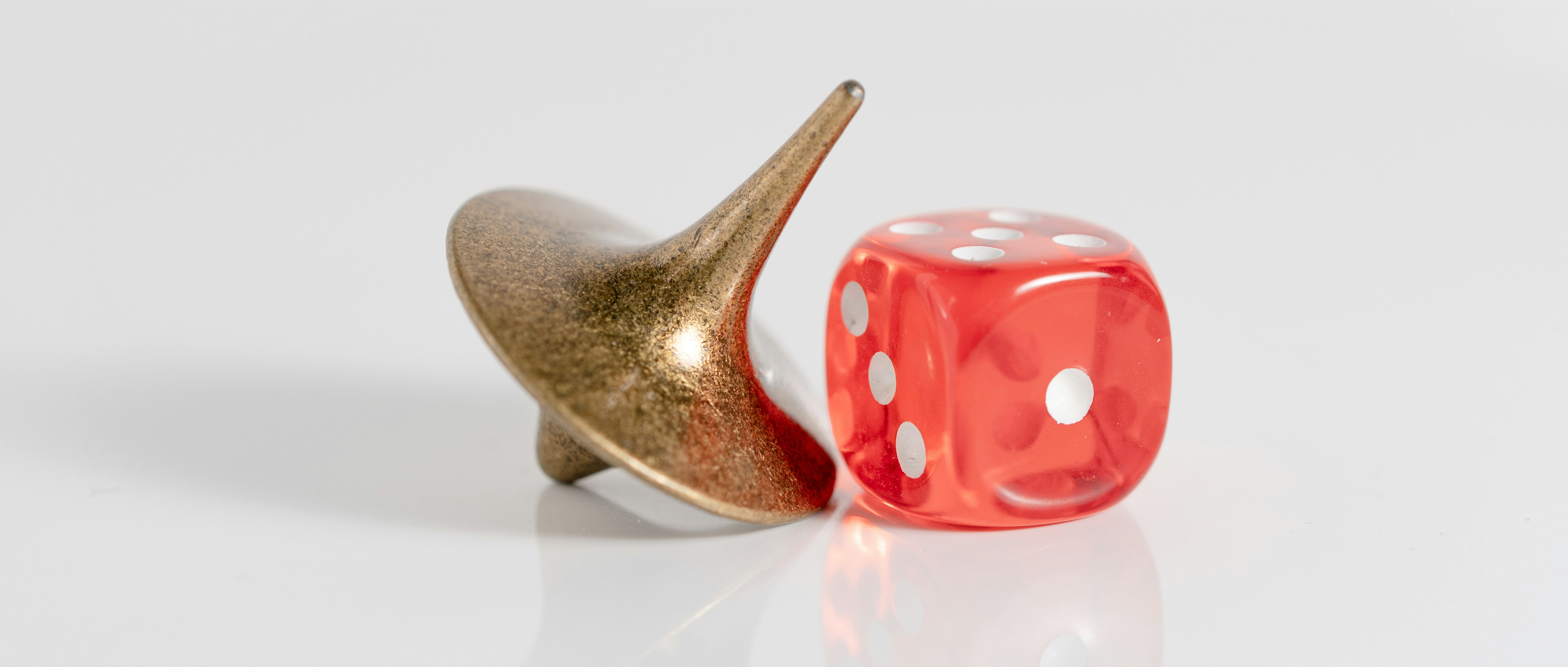 Gilded Curve and Ruby Die: a Minimal Still Life