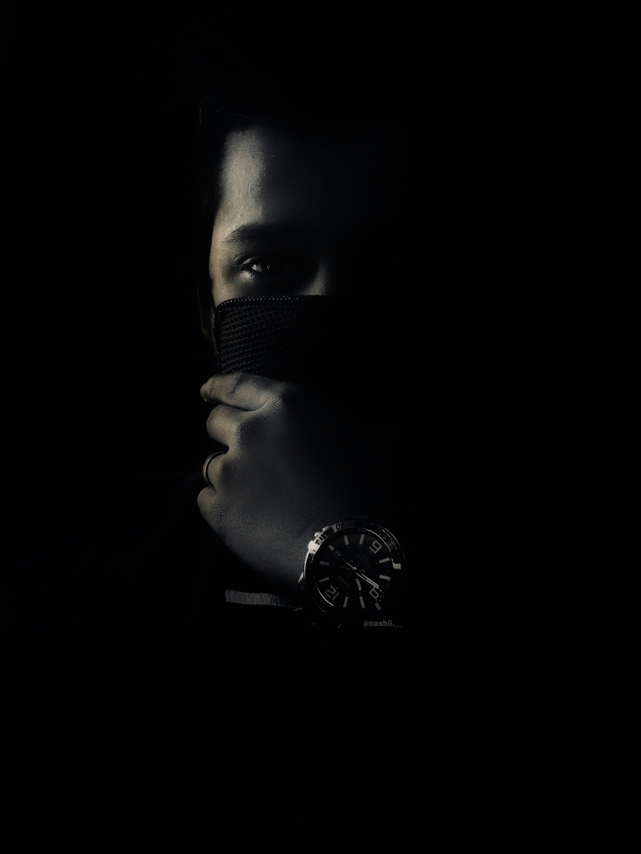Shadowed Gaze: A Watchful Moment in Low Light