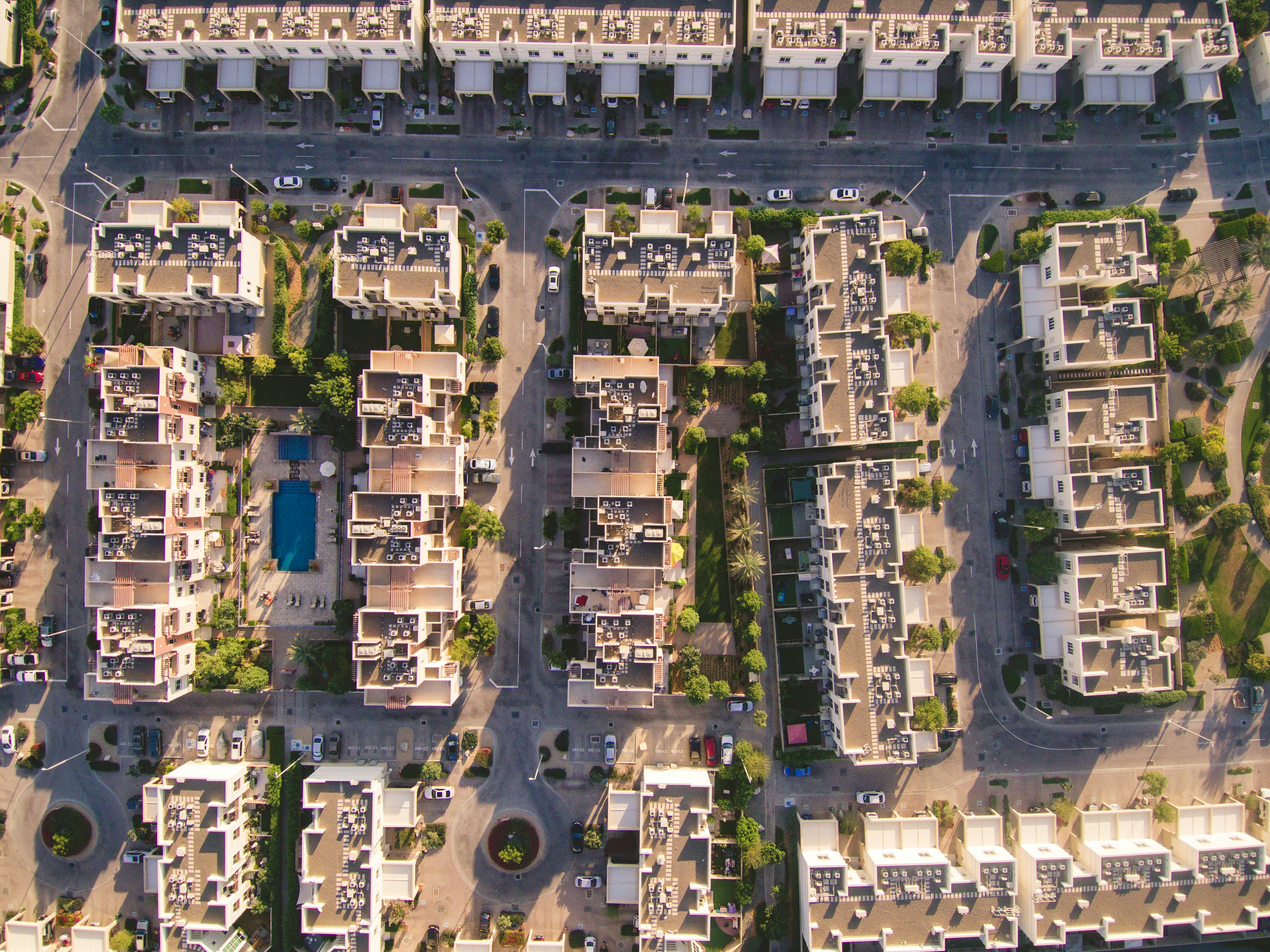 Geometric Oasis: Aerial View of Interlocking Townhomes and a Hidden Pool