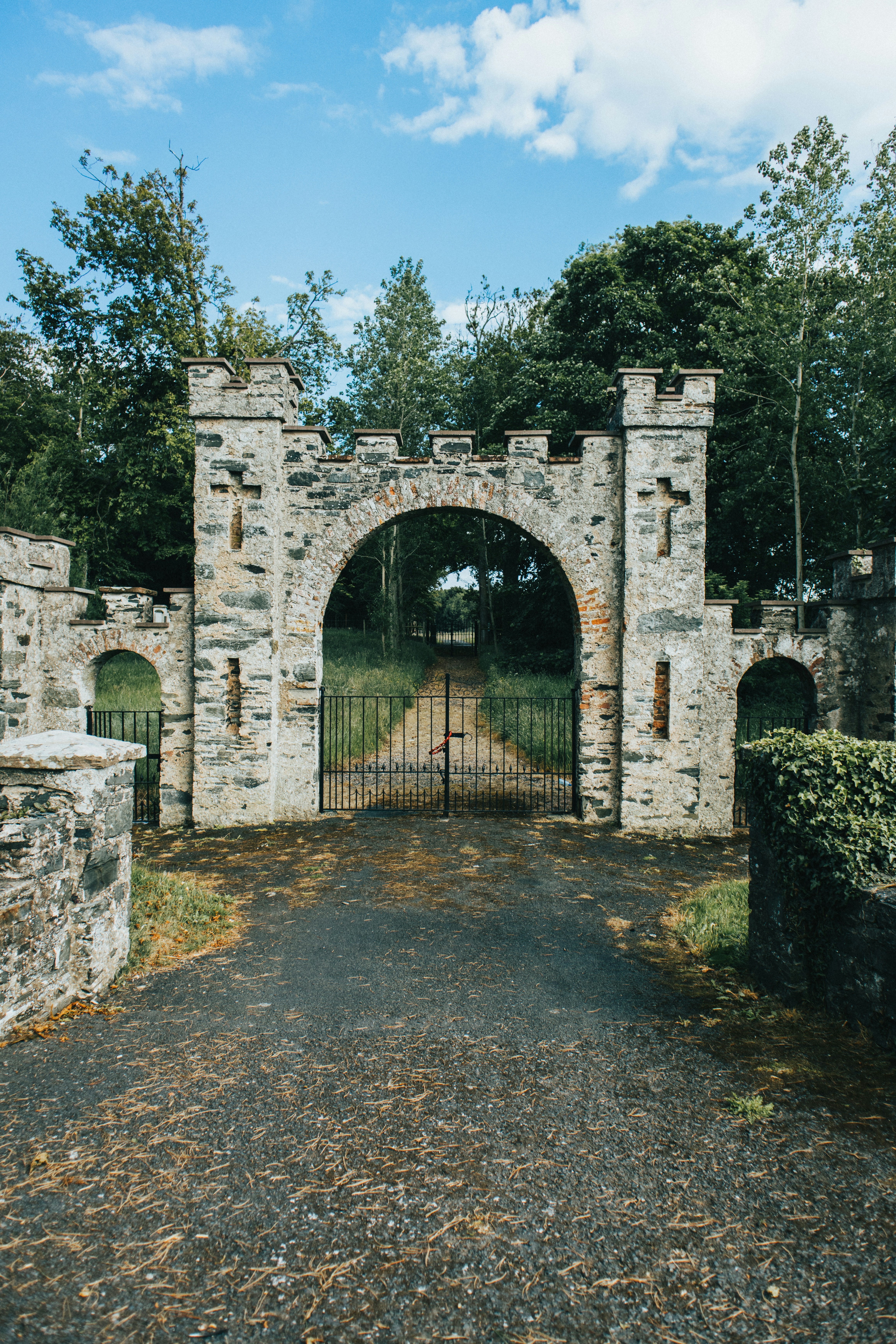 Gray brick arch gate under blue sky during daytime photo – Free Ground ...