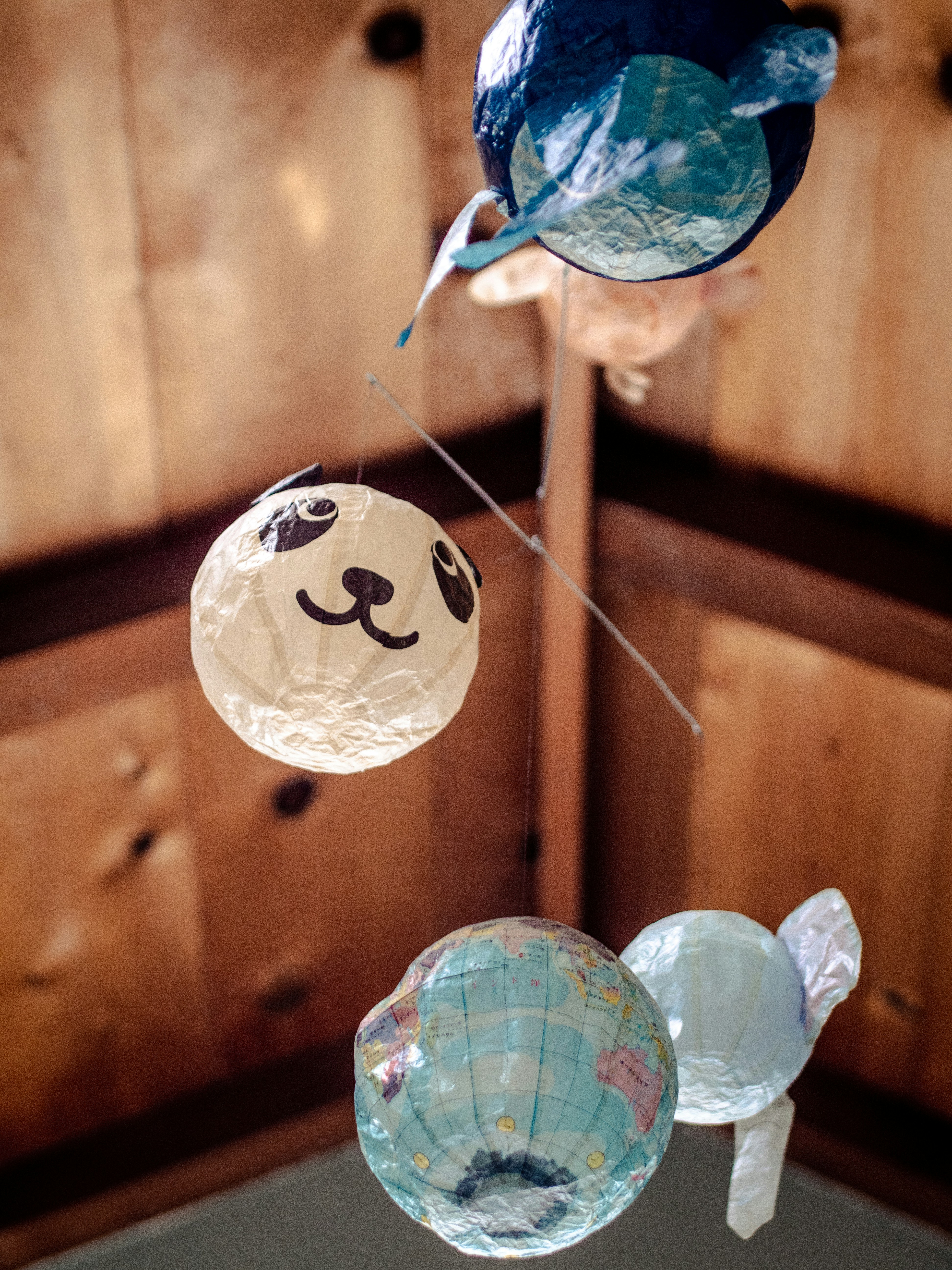 Floating Lanterns in a Cozy Wooden Ceiling