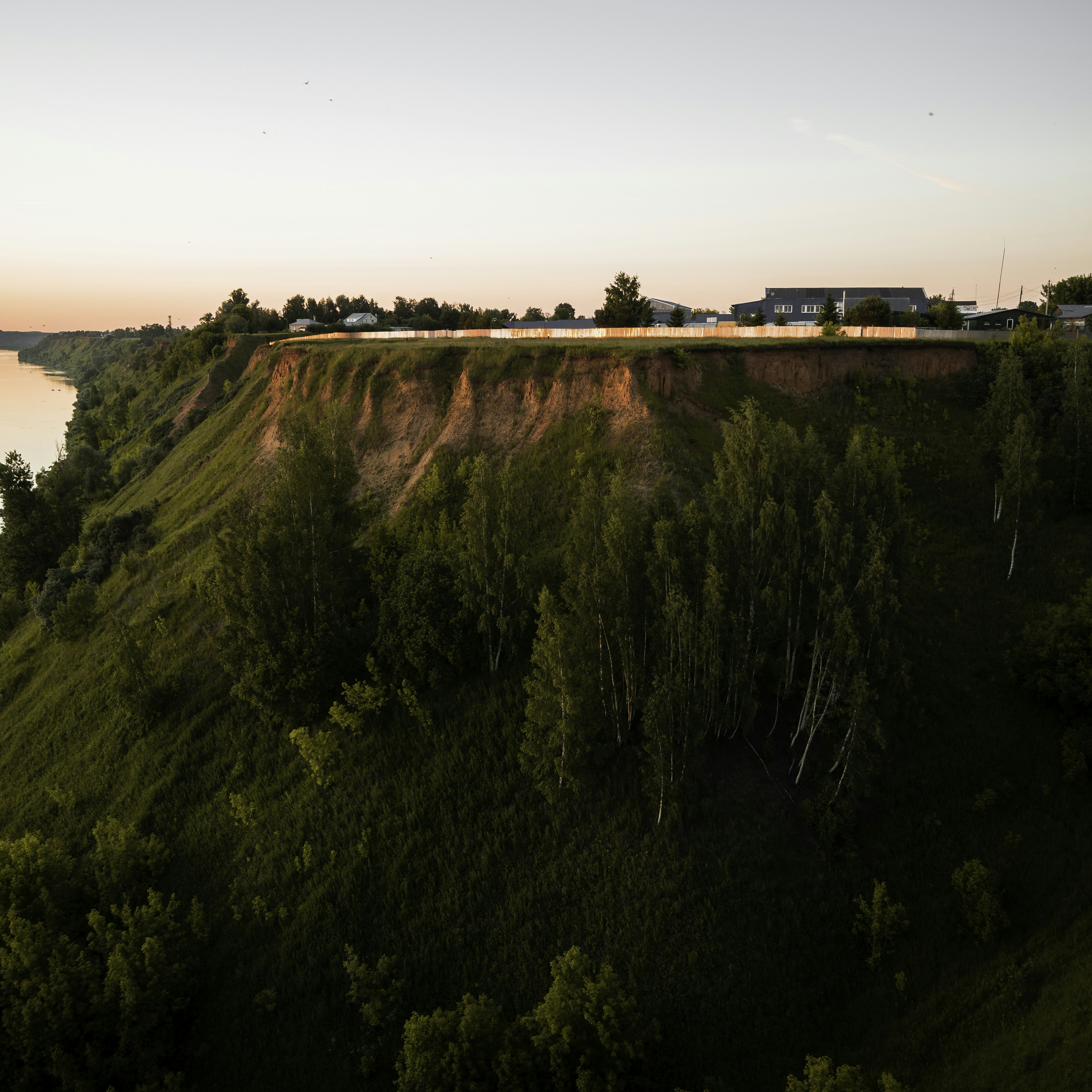 Clifftop Sunset Over a Quiet Riverbend