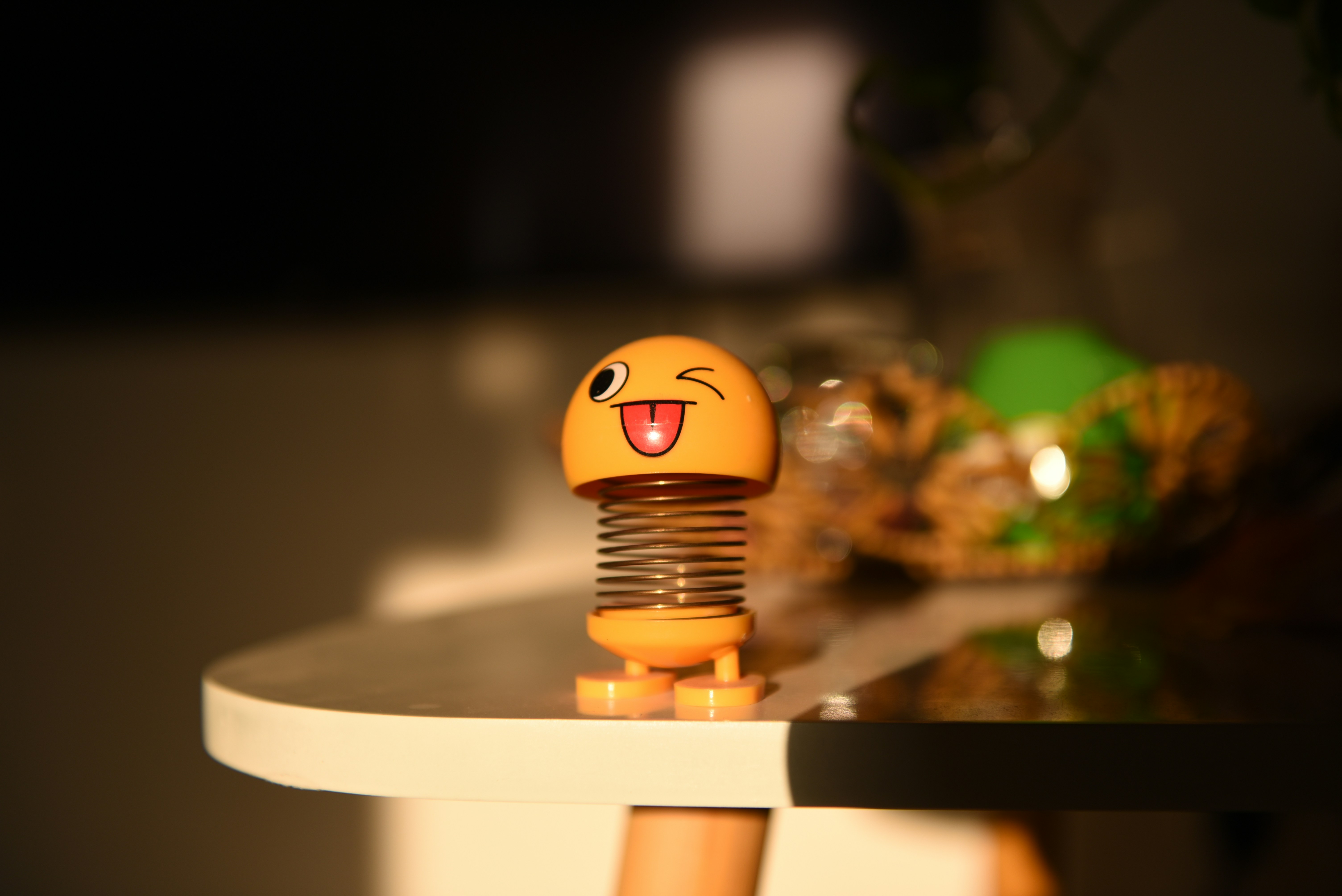 Emoji on a Spring-Stemmed Stool: A Cozy Tabletop Portrait