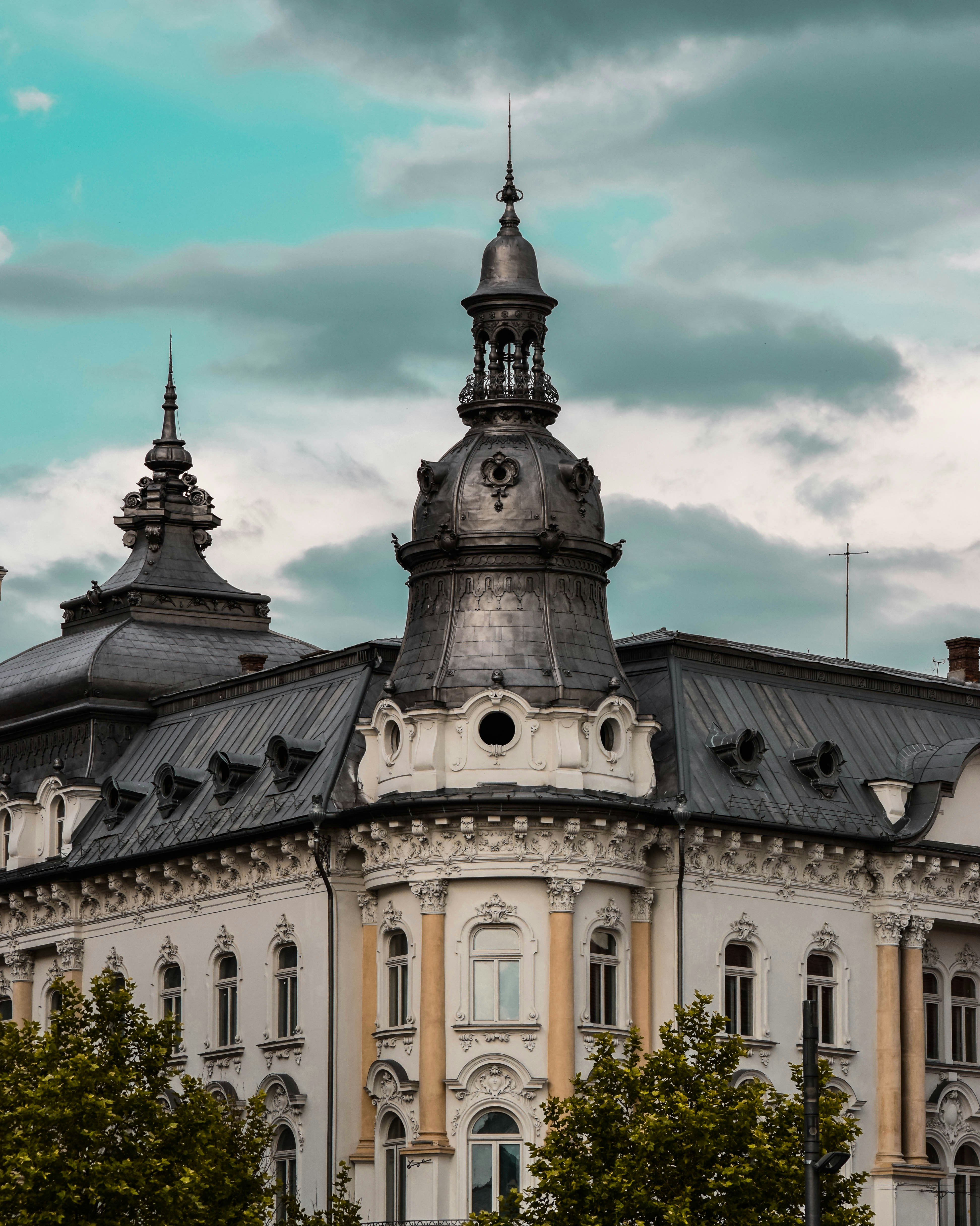 White and black concrete building under blue sky during daytime photo ...