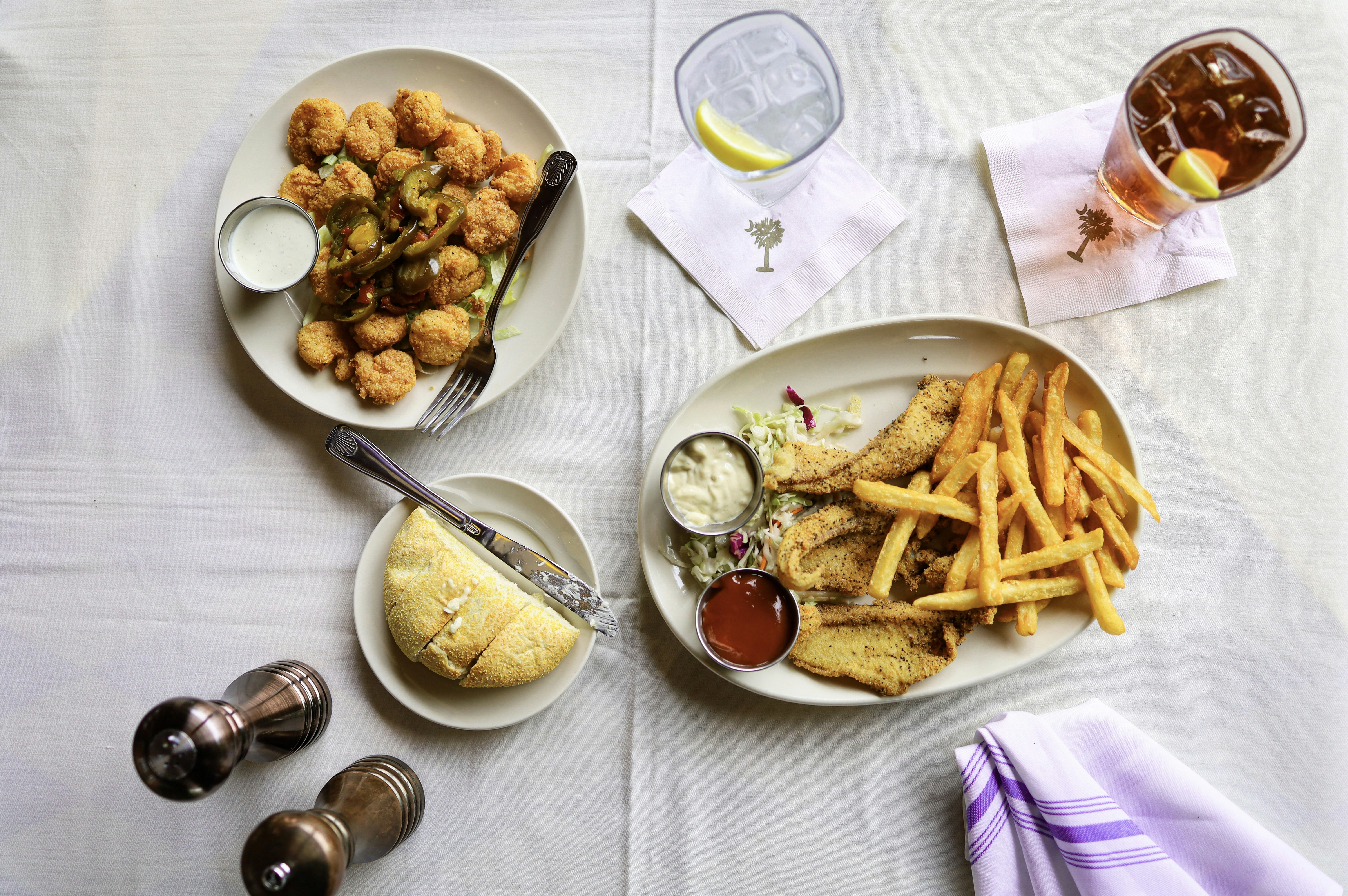 Top-Down Feast: Shared Plates of Fried Chicken Tenders, Fries, and Desserts