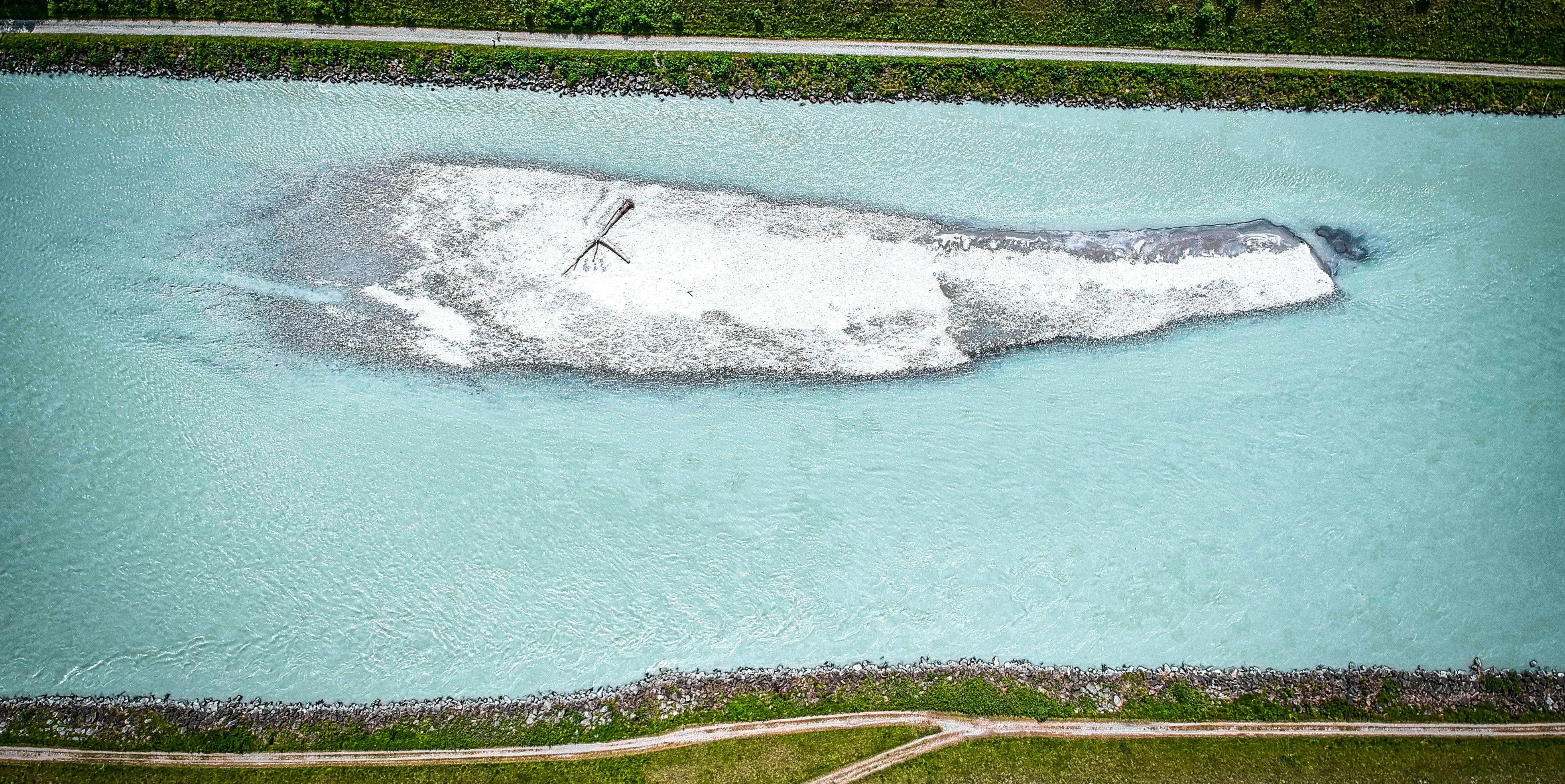 Solitary White Island in a Turquoise Canal