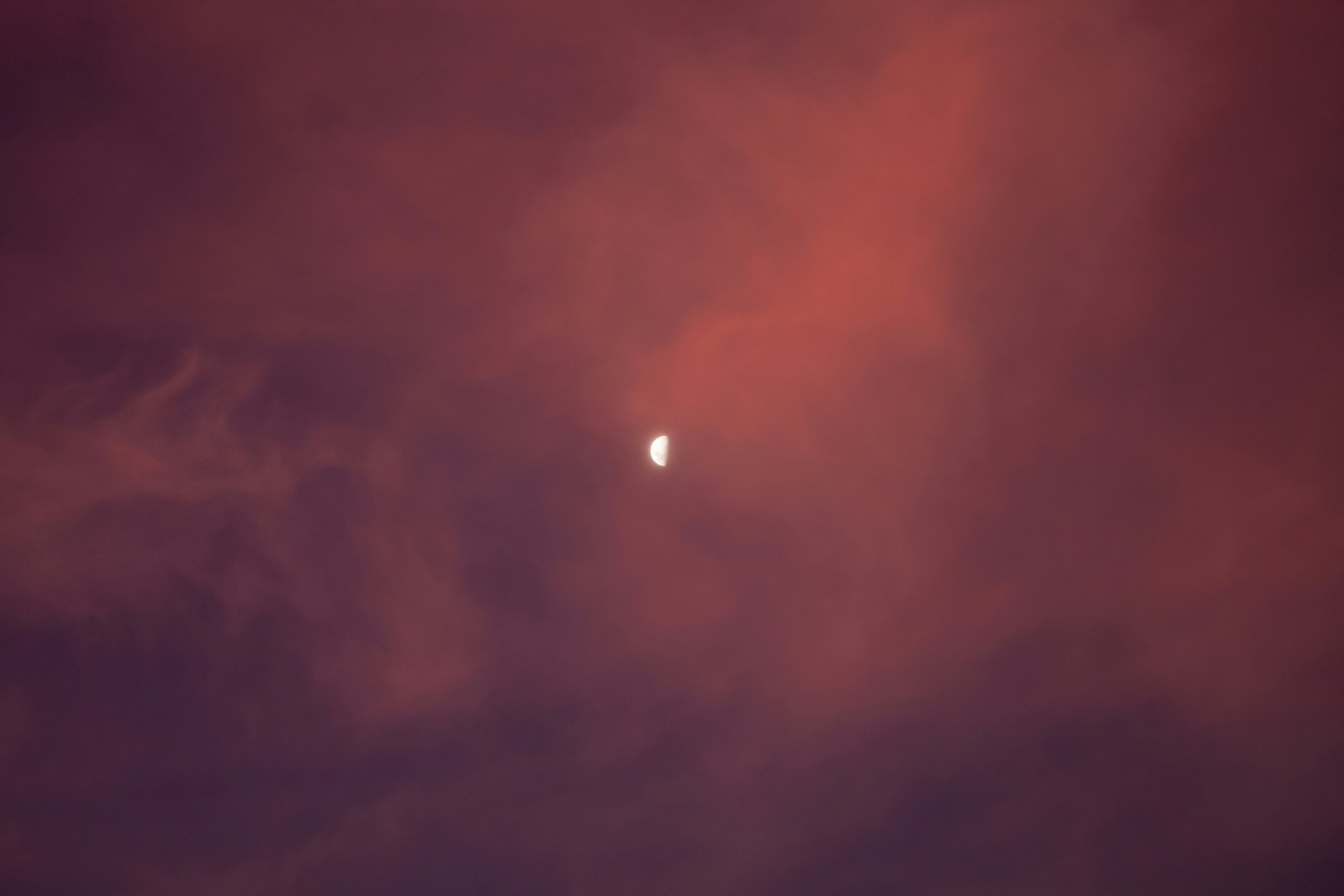 Lunar Glow Amidst Scarlet Skies