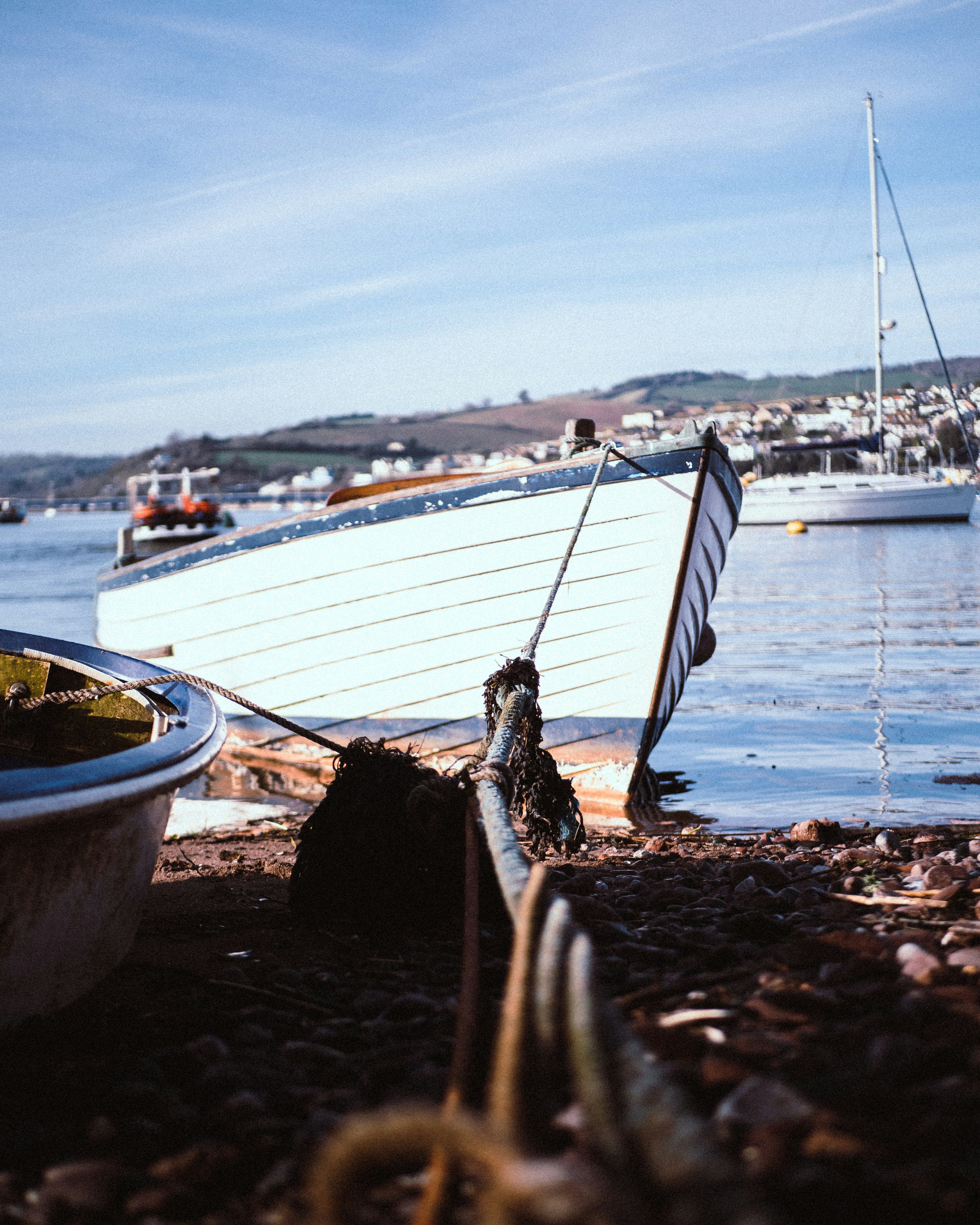 white boat on sea during daytime