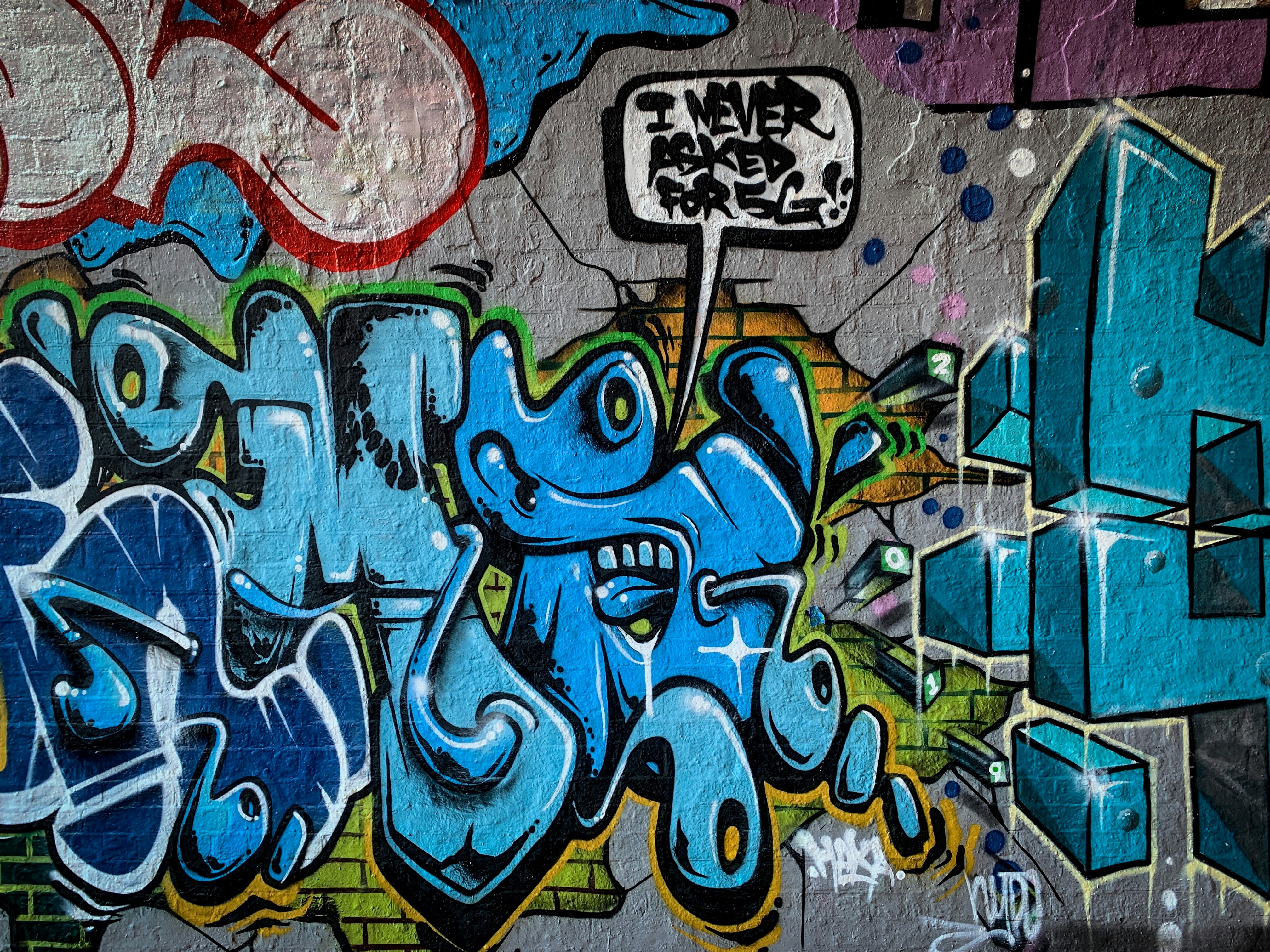 Blue and red graffiti on wall photo – Free Bristol Image on Unsplash