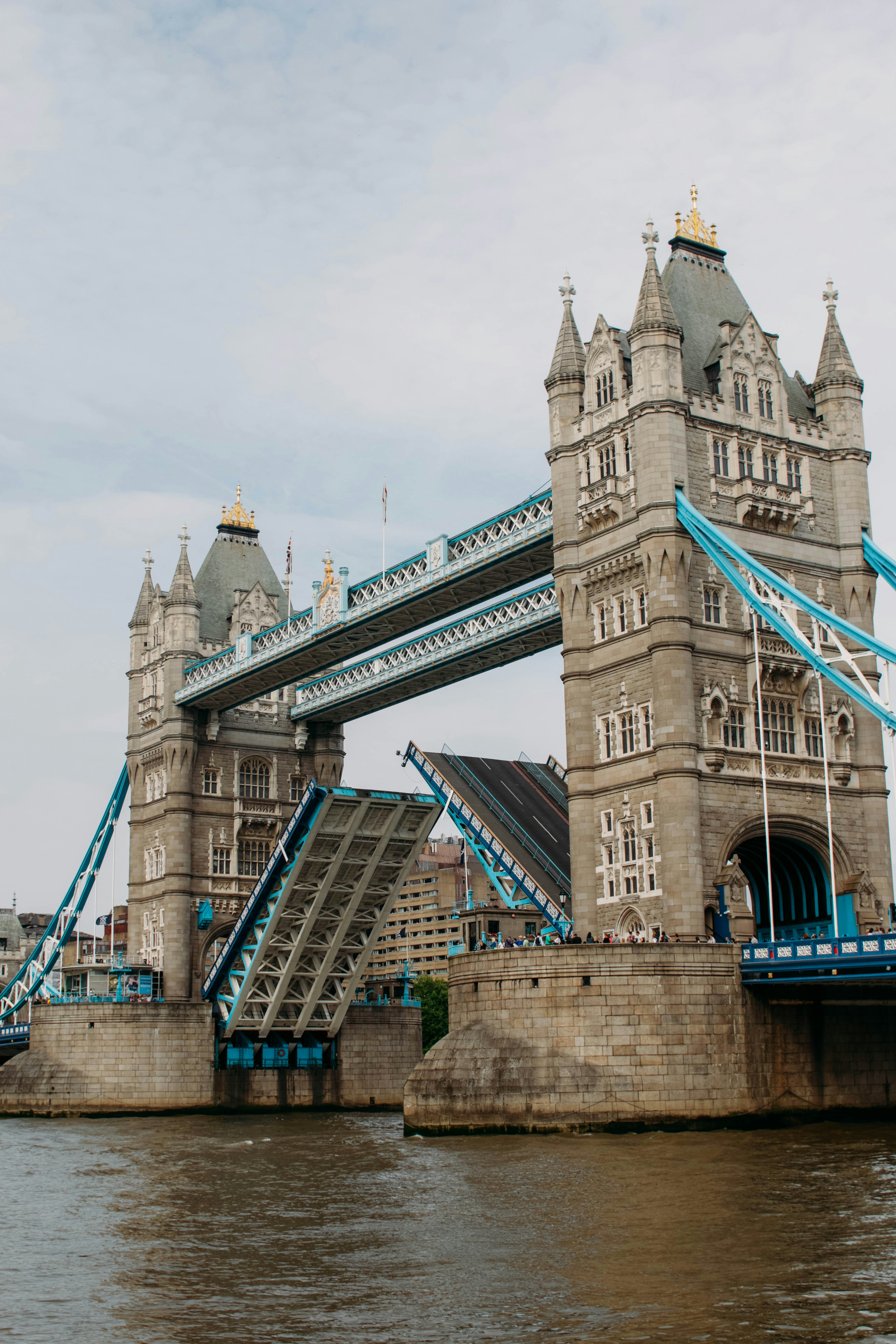 Mid-Raise Reverie: Tower Bridge's Blue Bascules over the Thames