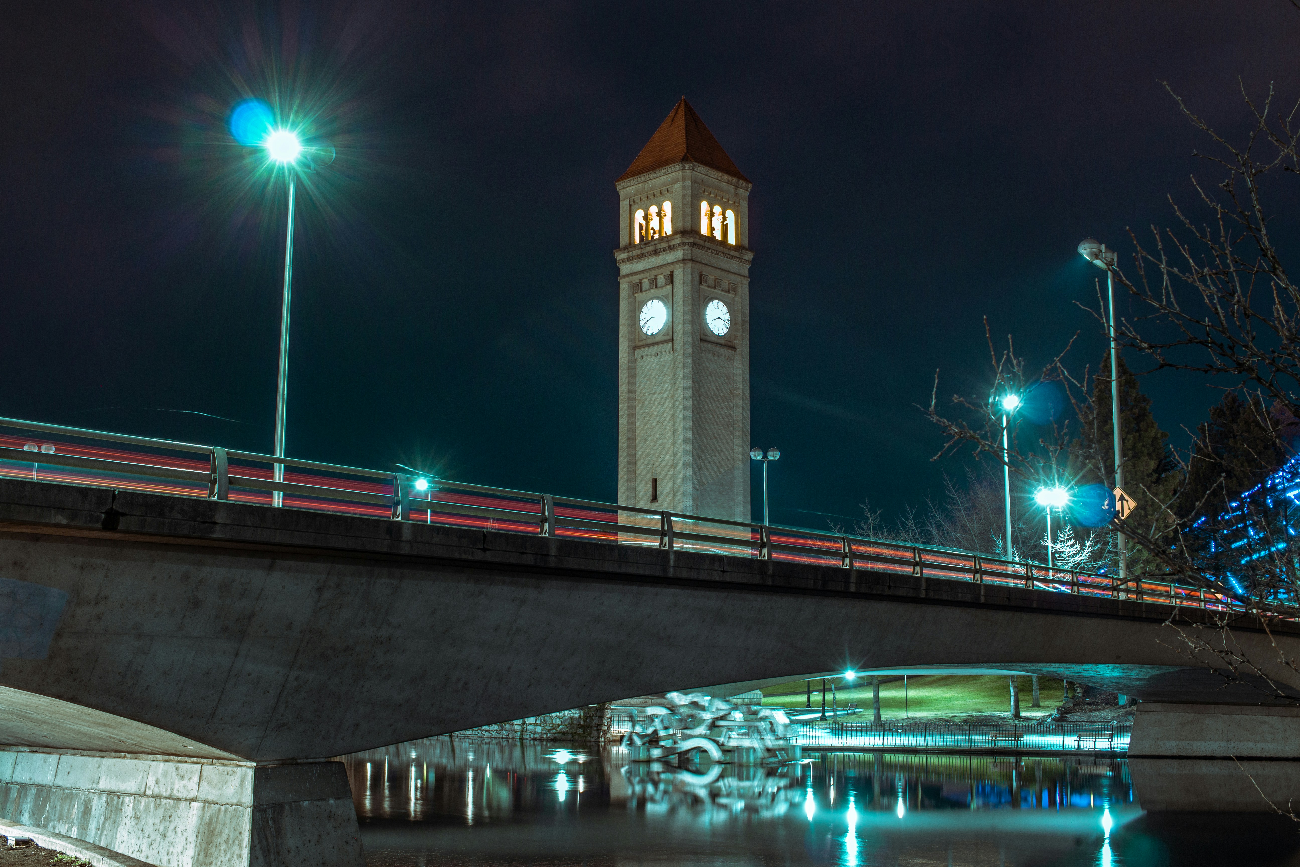 Clocktower Over the Water: Nighttime Bridge with Reflections