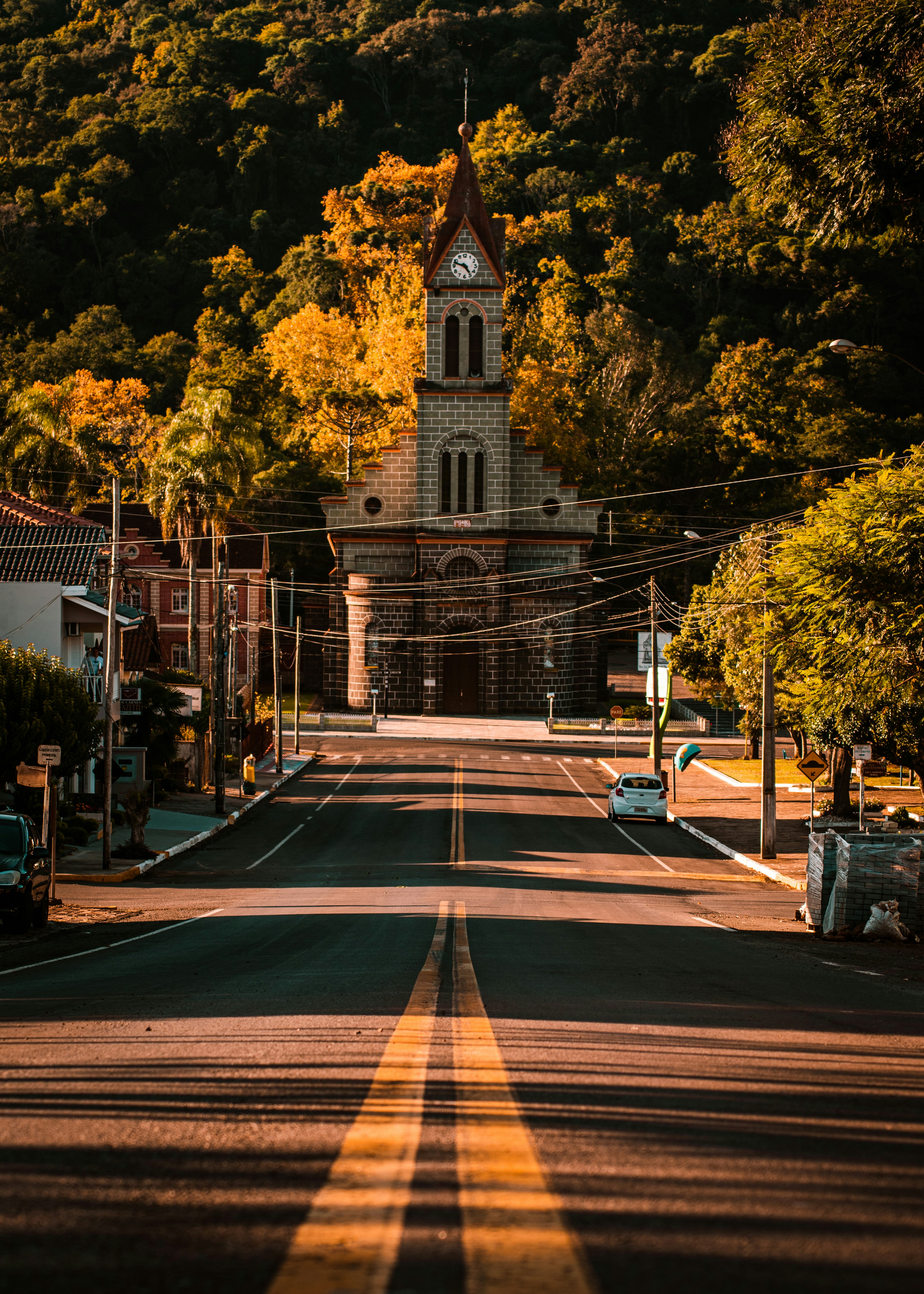 Sunlit Church at the End of Main Street