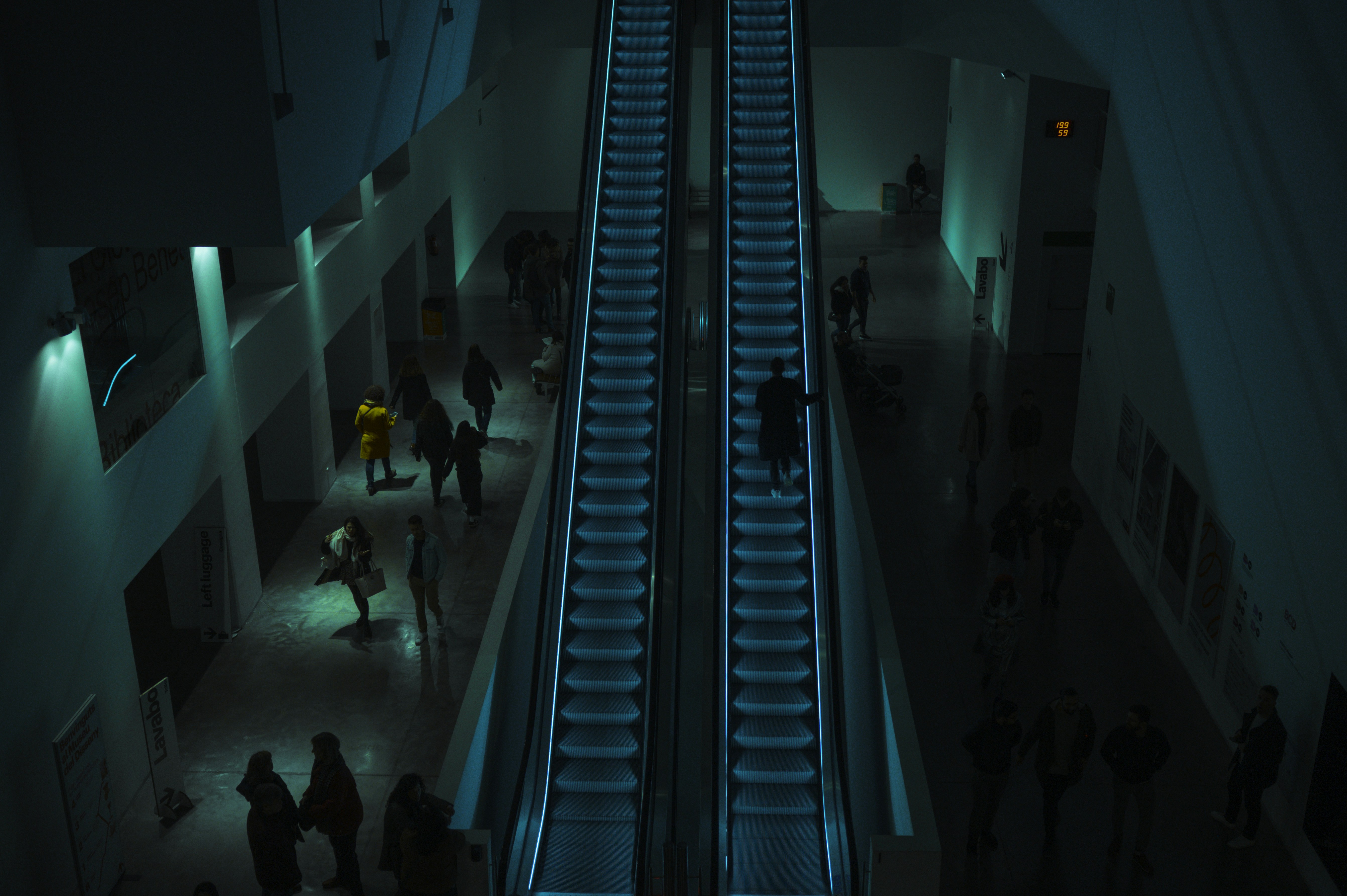Glowing Transit: Riders Encircle the Central Escalator