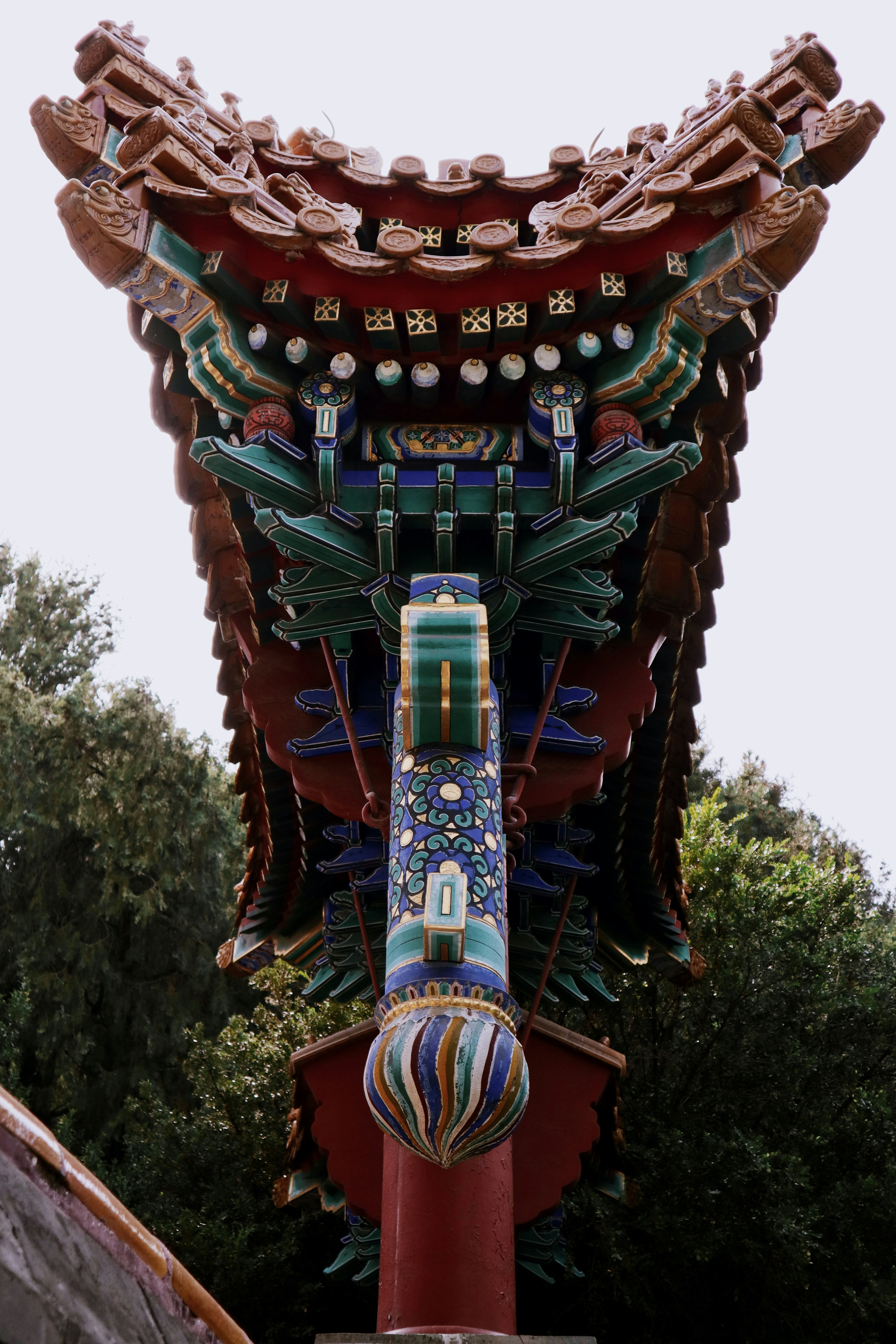 Intricately designed eaves of a traditional structure showcasing vibrant colors and detailed craftsmanship.