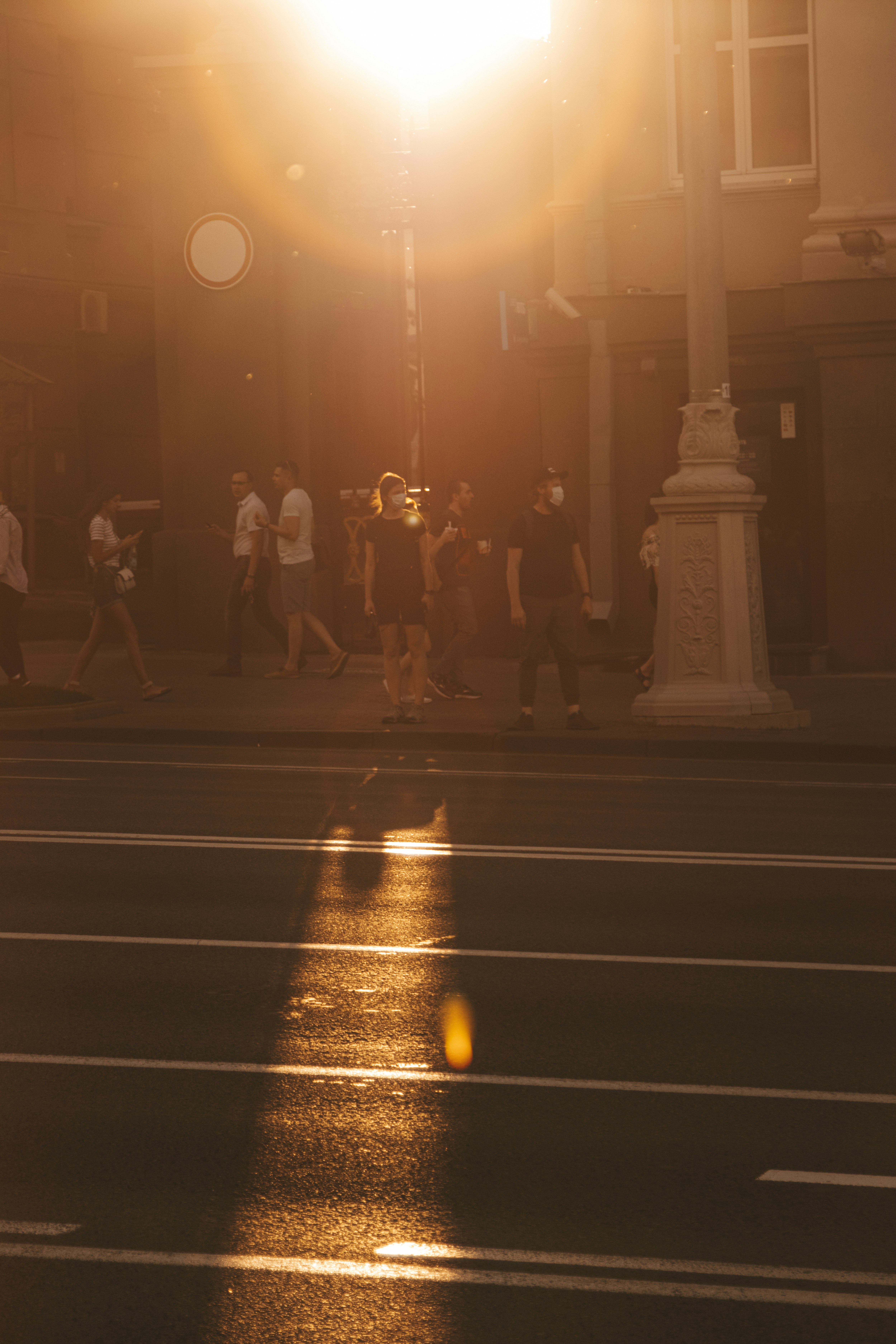 Sunburst on the Sidewalk: Pedestrians in a City Golden Hour