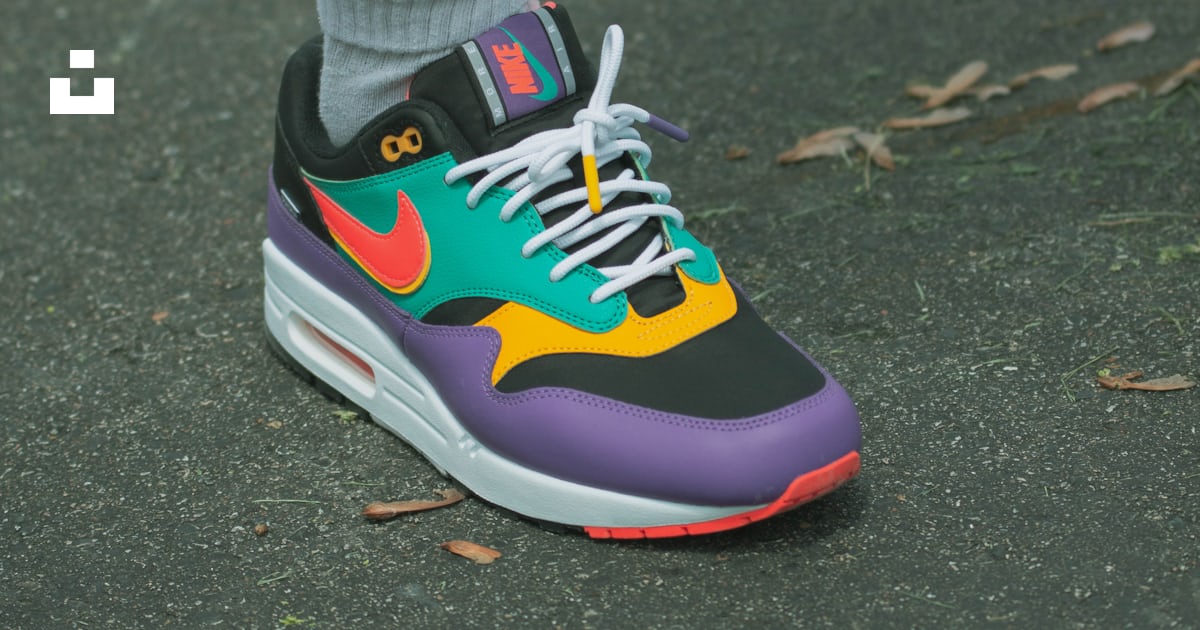 Person Wearing Purple And White Nike Athletic Shoes Photo Free