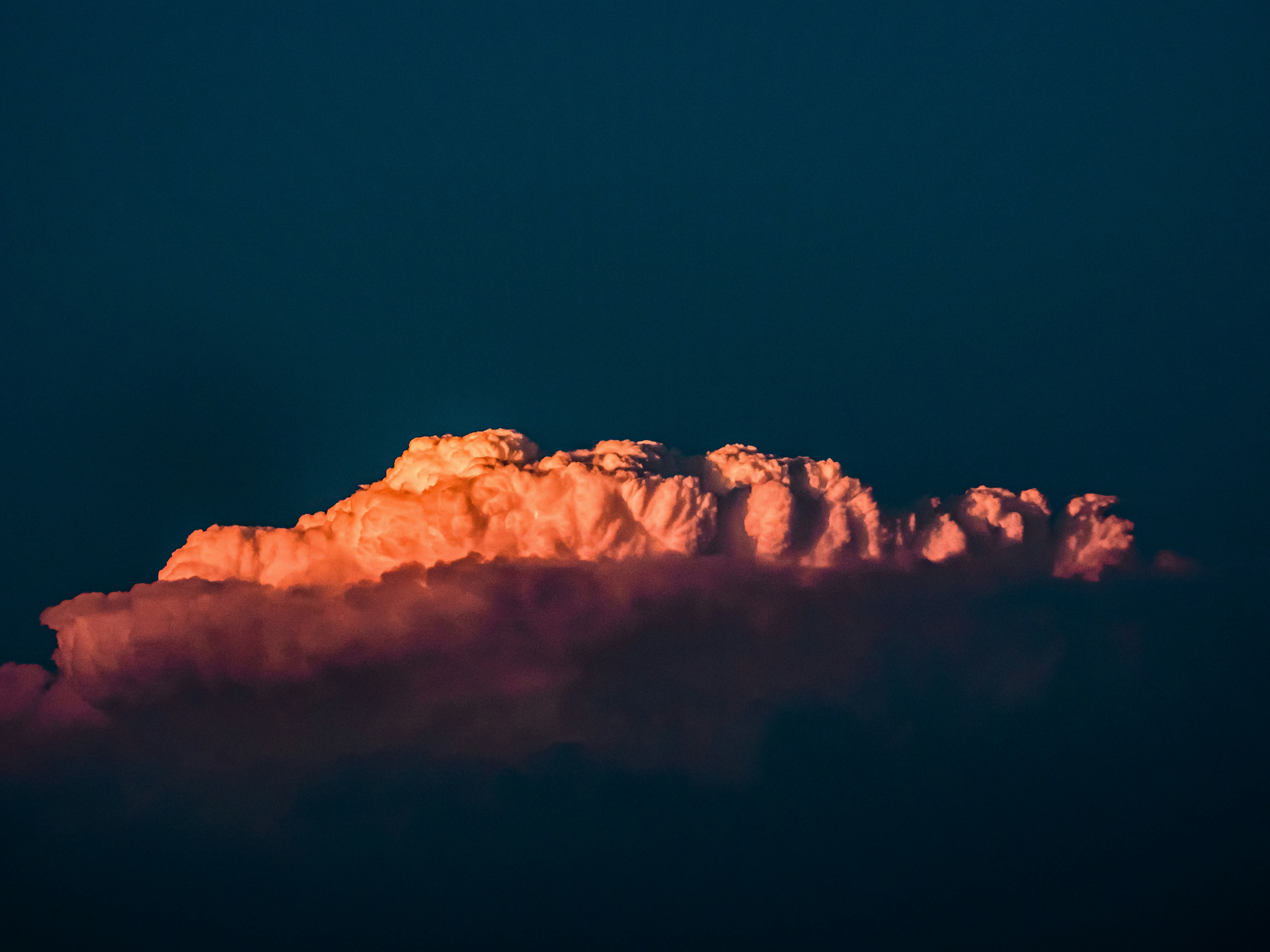 Cinder Cloud at Dusk: A Warm Riff on the Horizon