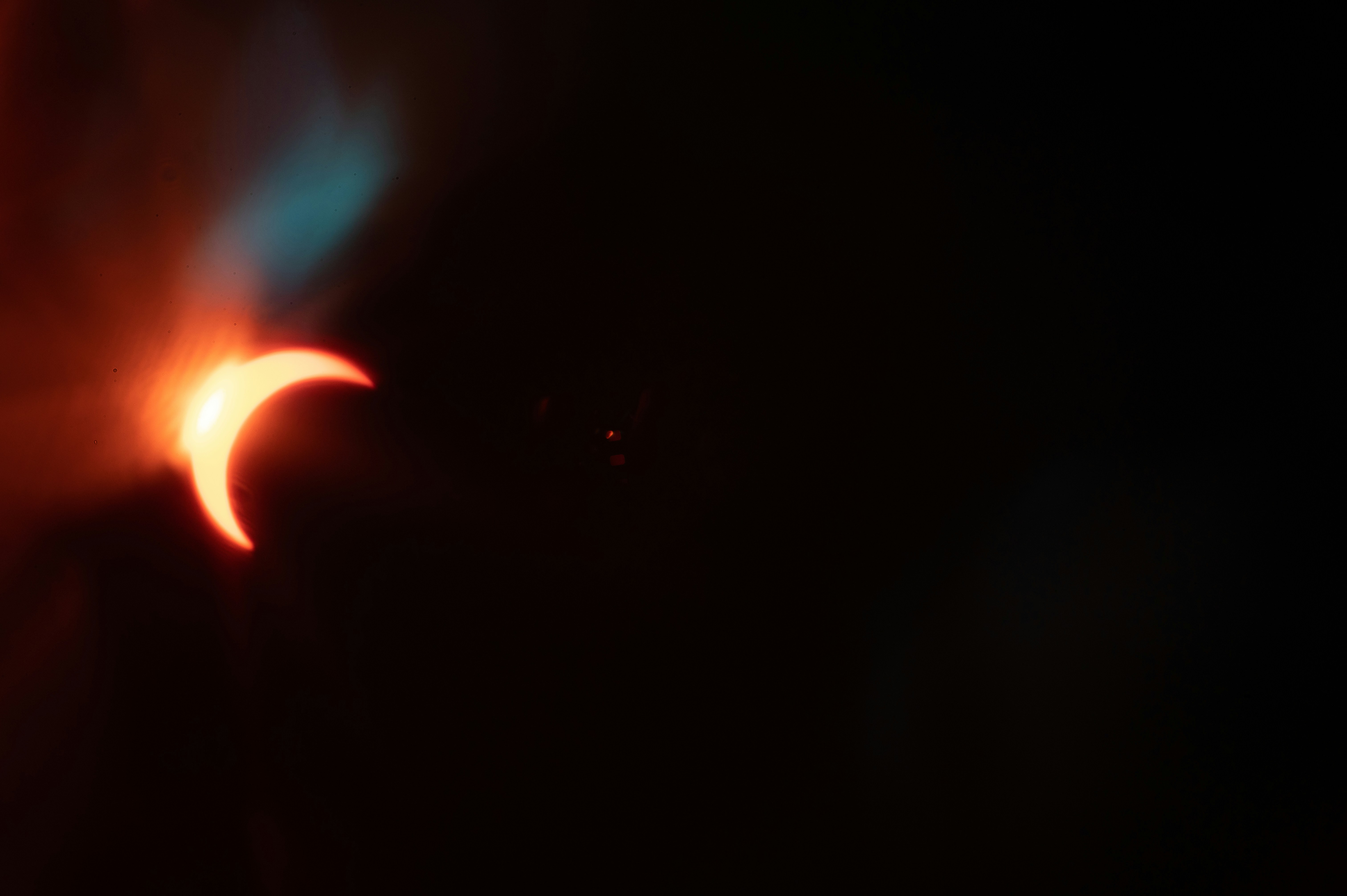 Crescent Ember: A Solar Sliver in Velvet Night