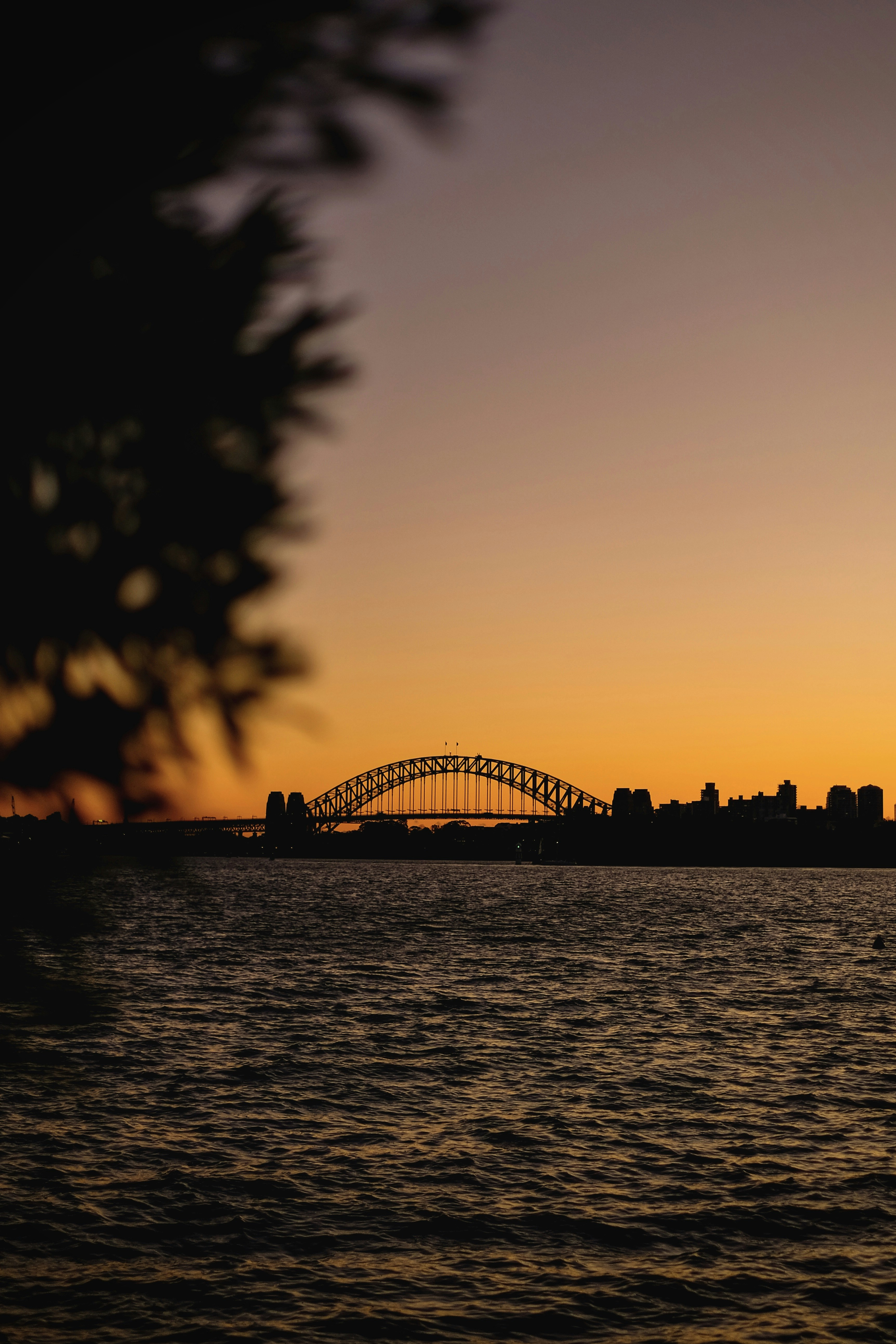 Molten Horizon and the Silhouetted Arch Bridge at Sunset
